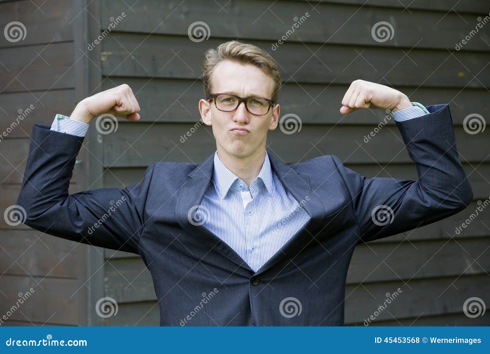 Young Businessman Flexing His Muscles Stock Photo - Image of confident ...