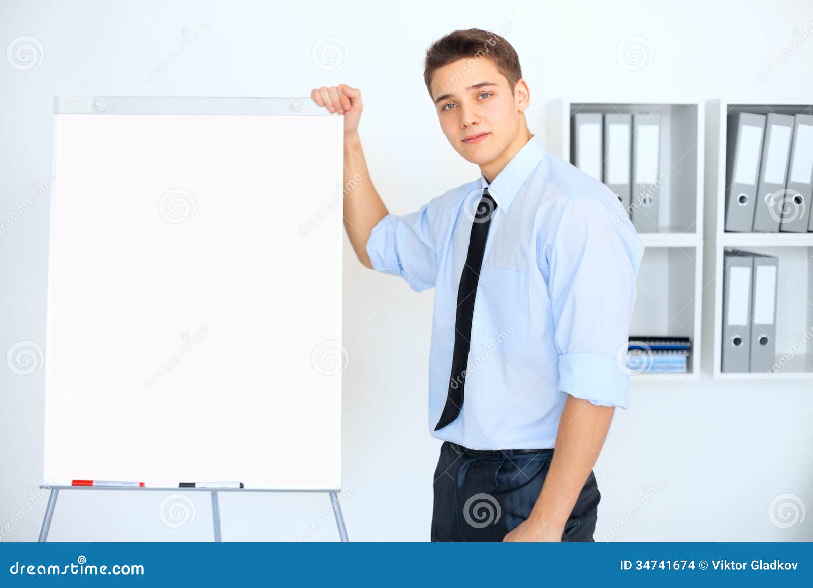Young Businessman with a Flip Chart during a Presentation Stock Photo ... Young Businessman with a Flip Chart during a Presentation Stock Photo ...