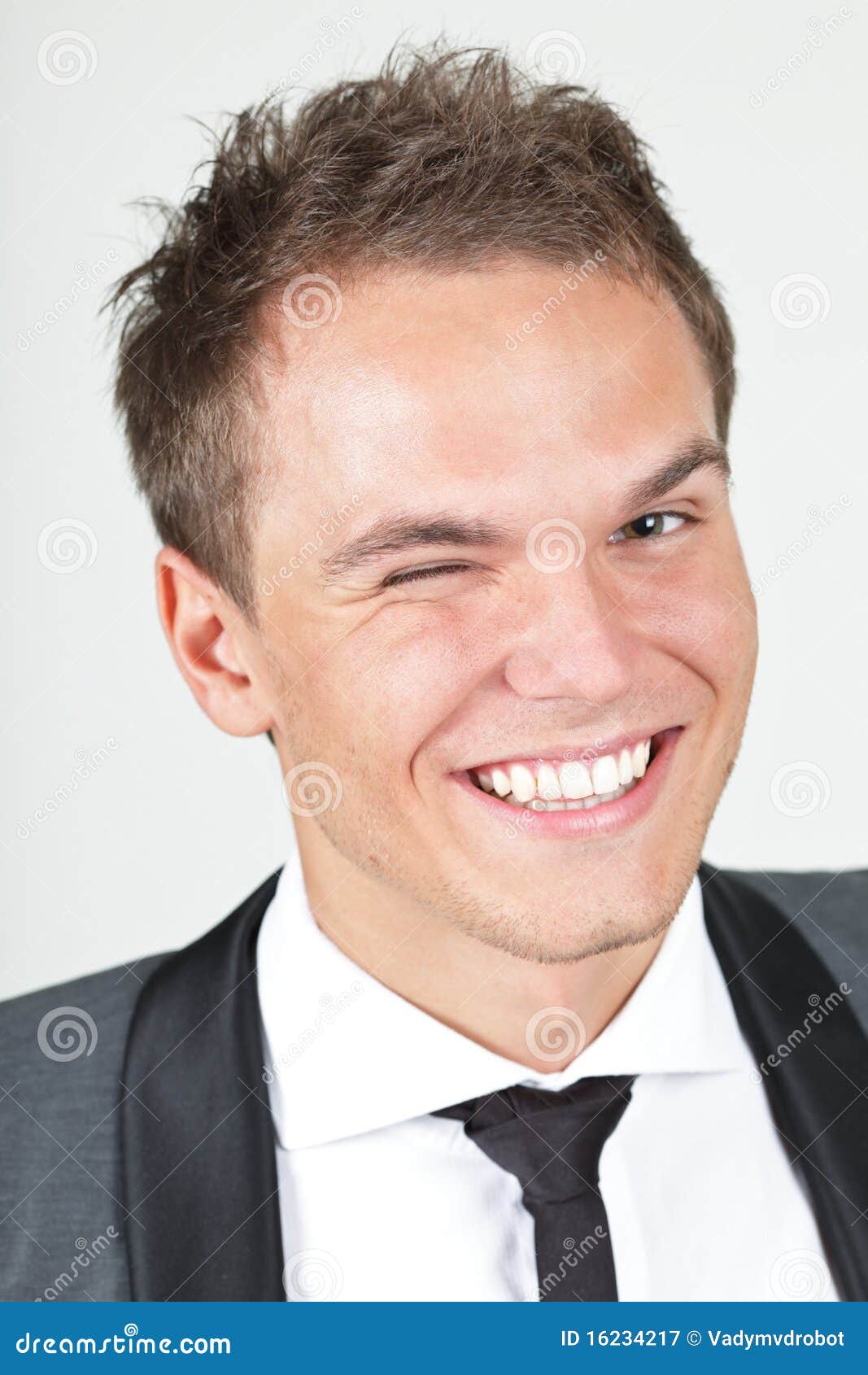 Young Businessman Giving a Wink Stock Image - Image of carefree, mouth ...