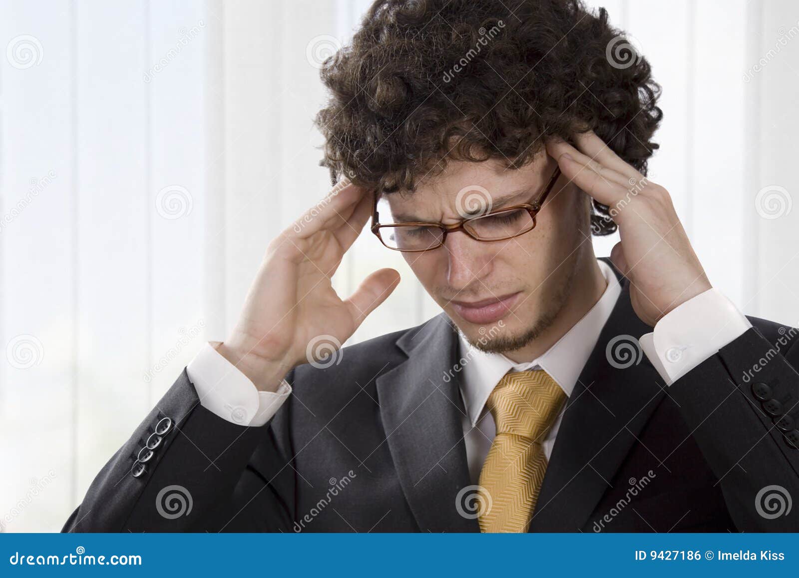 Young Businessman Having a Headache Stock Photo - Image of stress, male ...