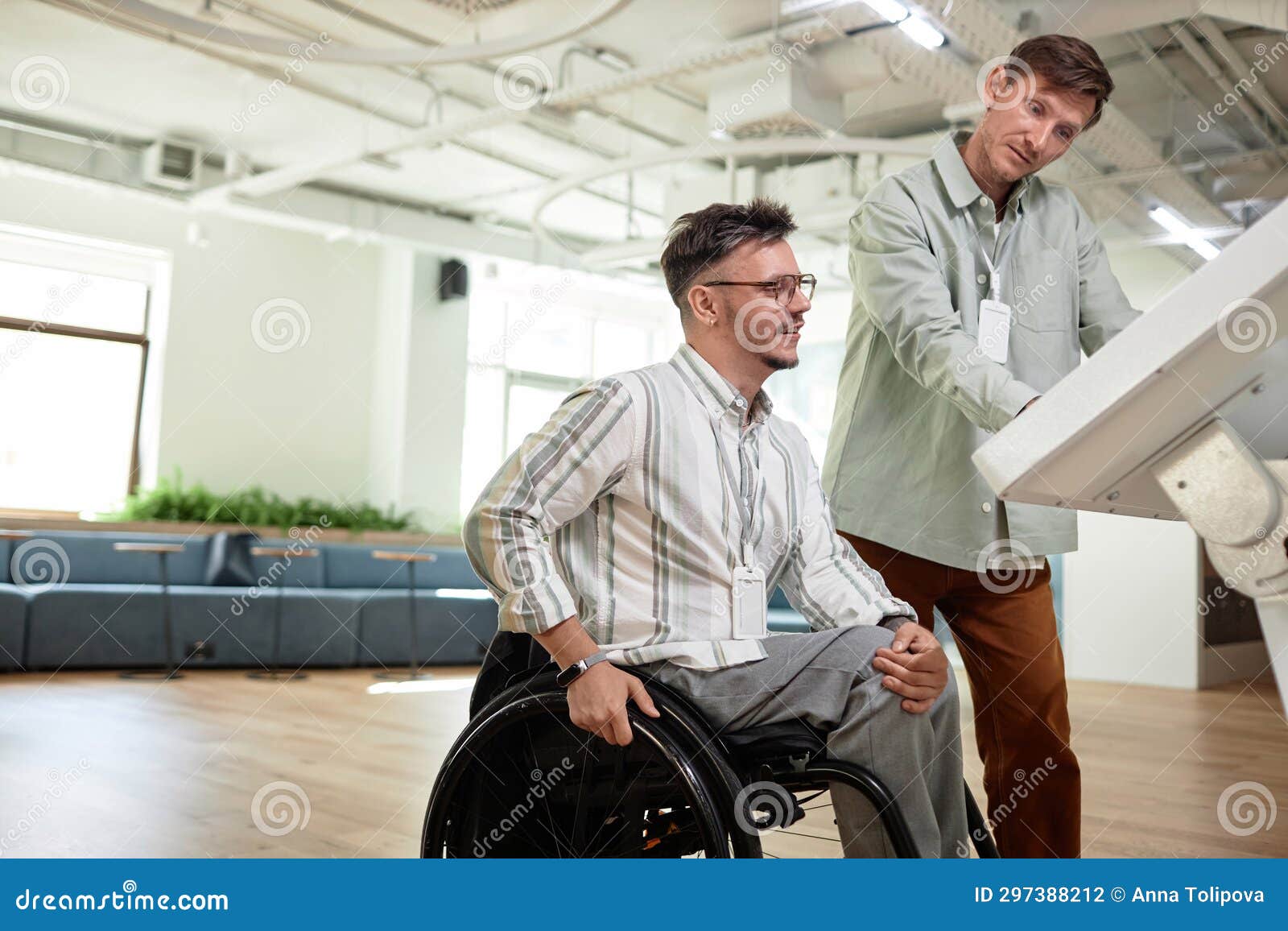 Man with Disability Using Assistant Computer with Businessman Stock ...
