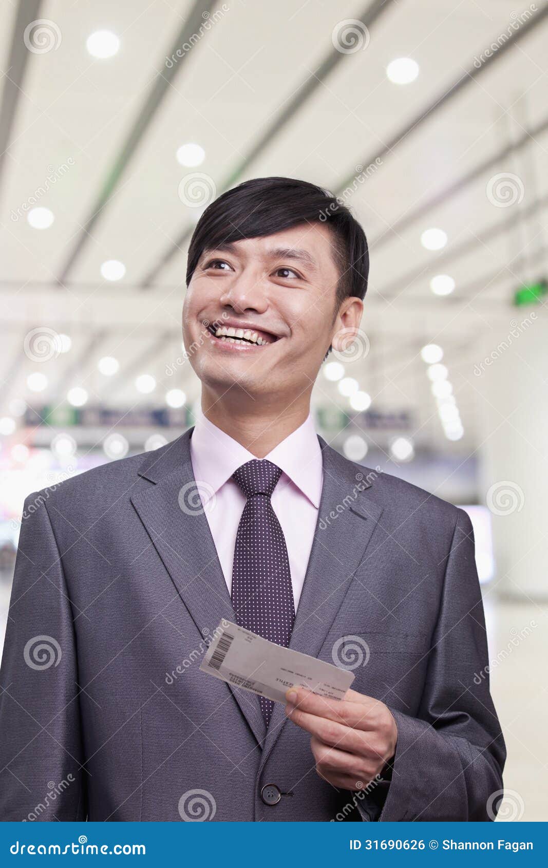 Young Businessman Holding Airplane Ticket, Beijing Stock Photo - Image ...