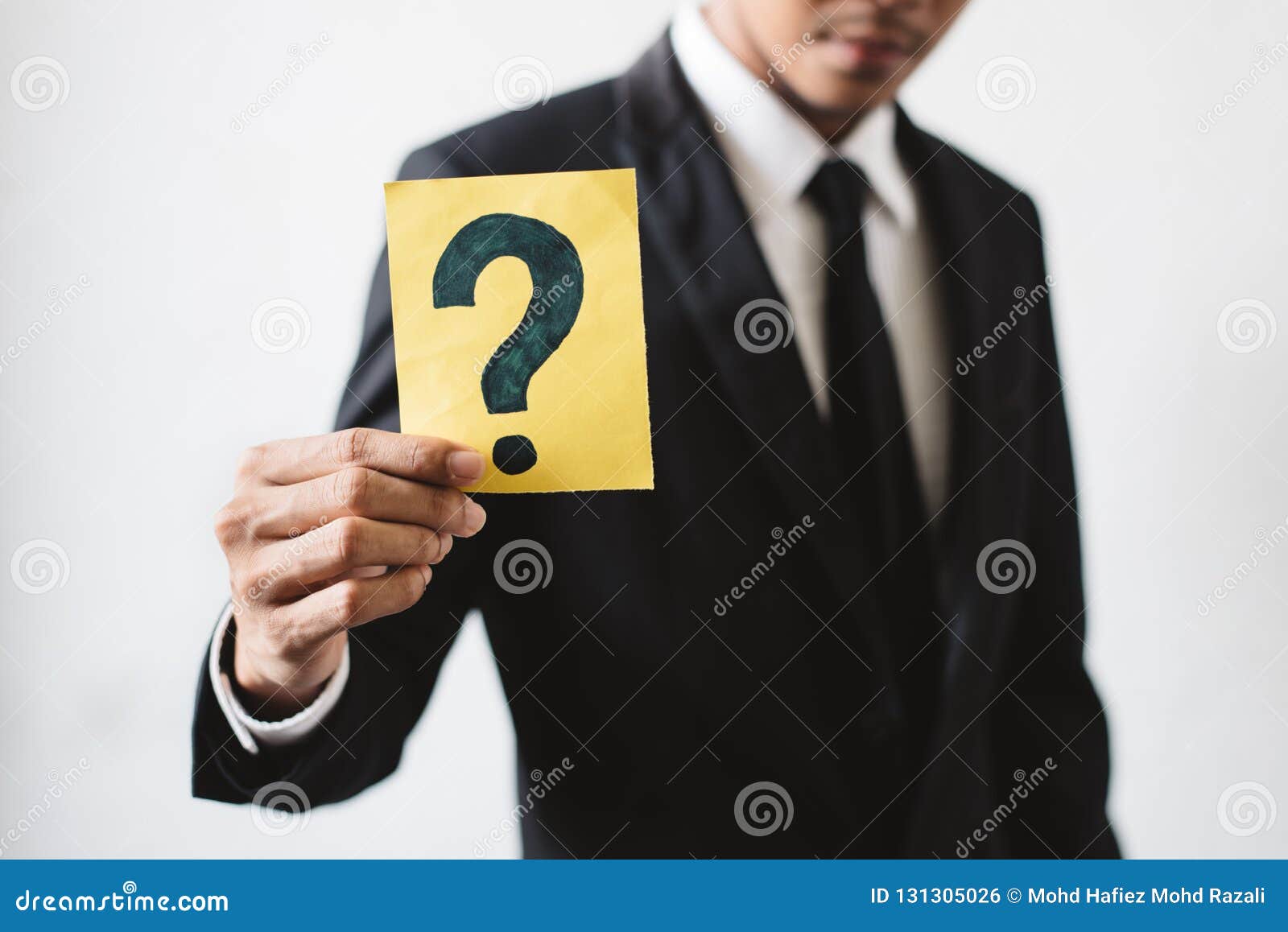 Young Businessman Holding a Card with QUESTION MARK Stock Photo - Image ...