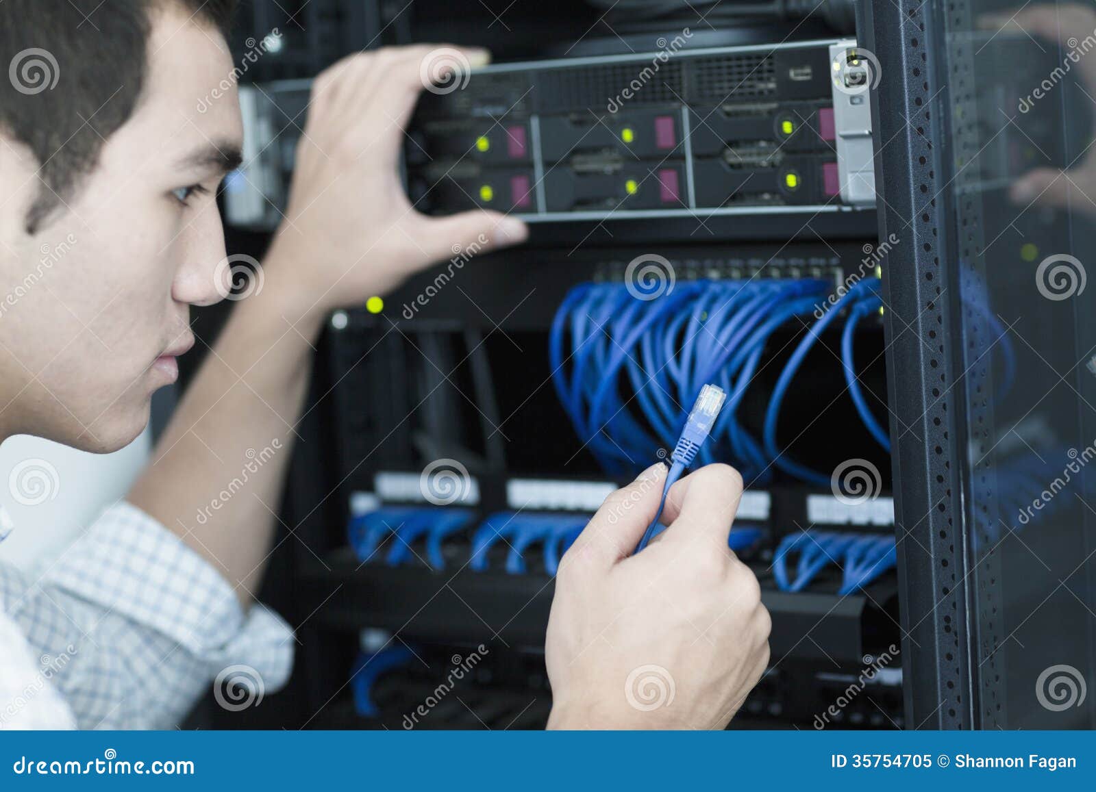 Young Businessman Holding and Plugging in a Computer Cable Stock Image ...