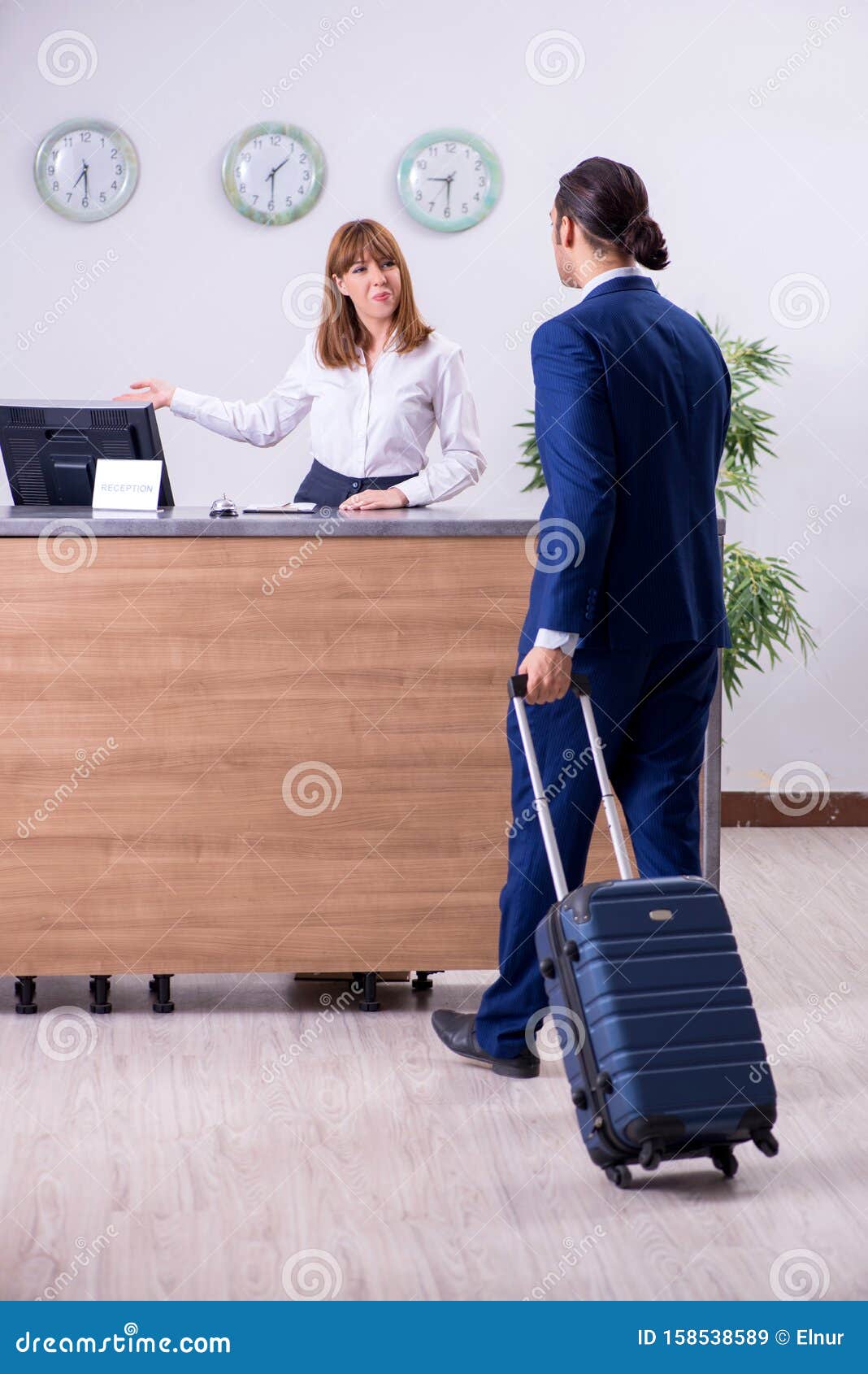 Young Businessman at Hotel Reception Stock Image - Image of employee ...