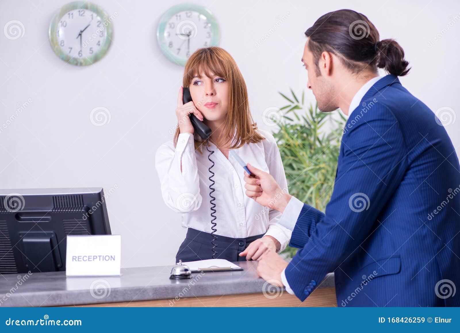 Young Businessman at Hotel Reception Stock Image - Image of departing ...