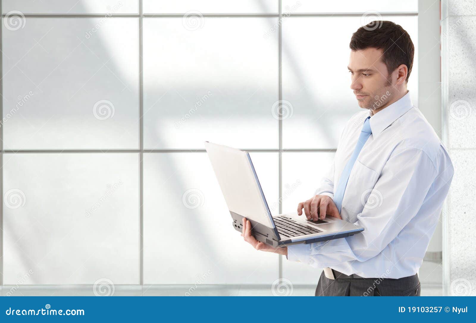 Young Businessman with Laptop Stock Image - Image of american ...