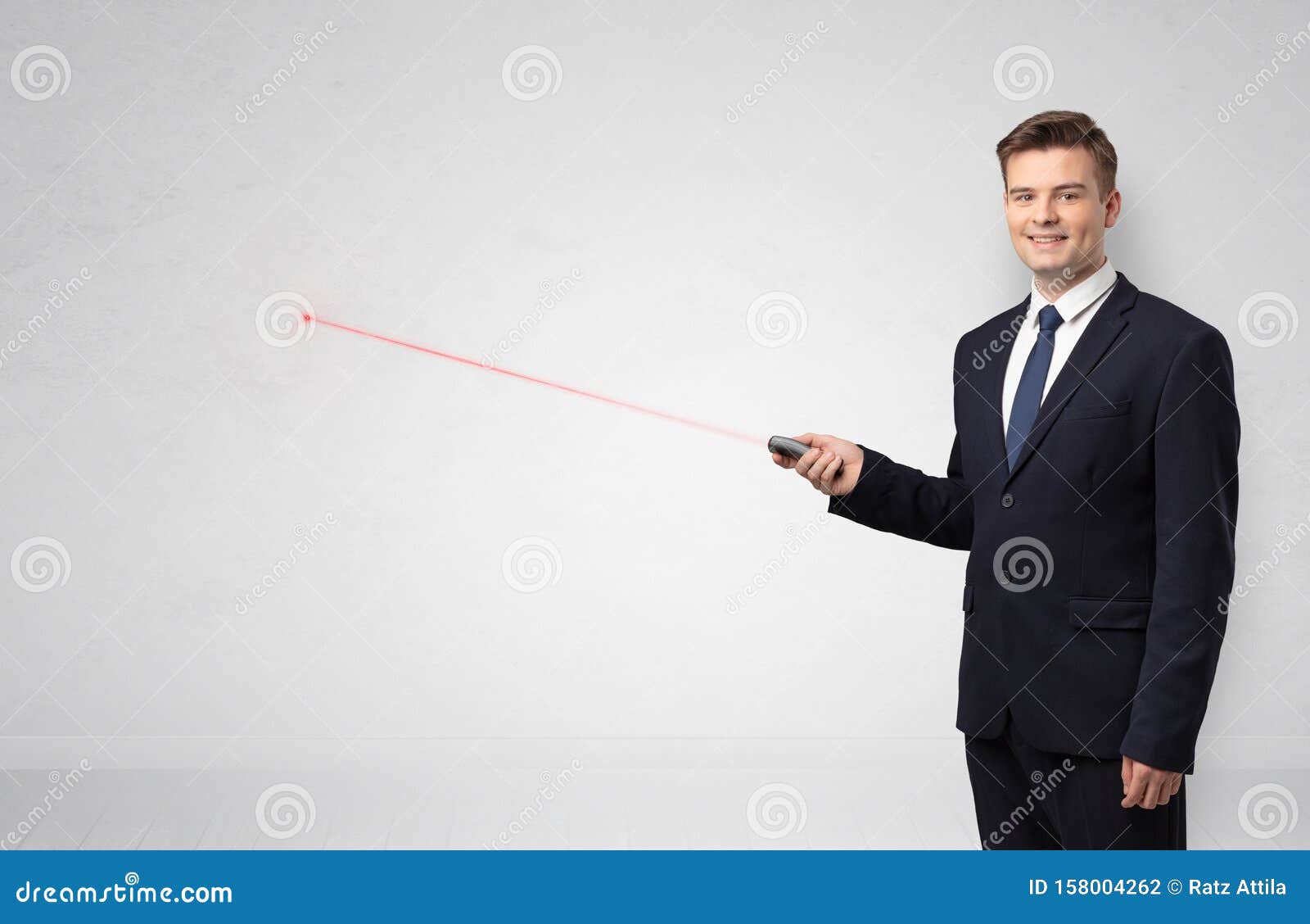 Businessman with Laser Pointer and Copyspace White Wall Stock Photo ...