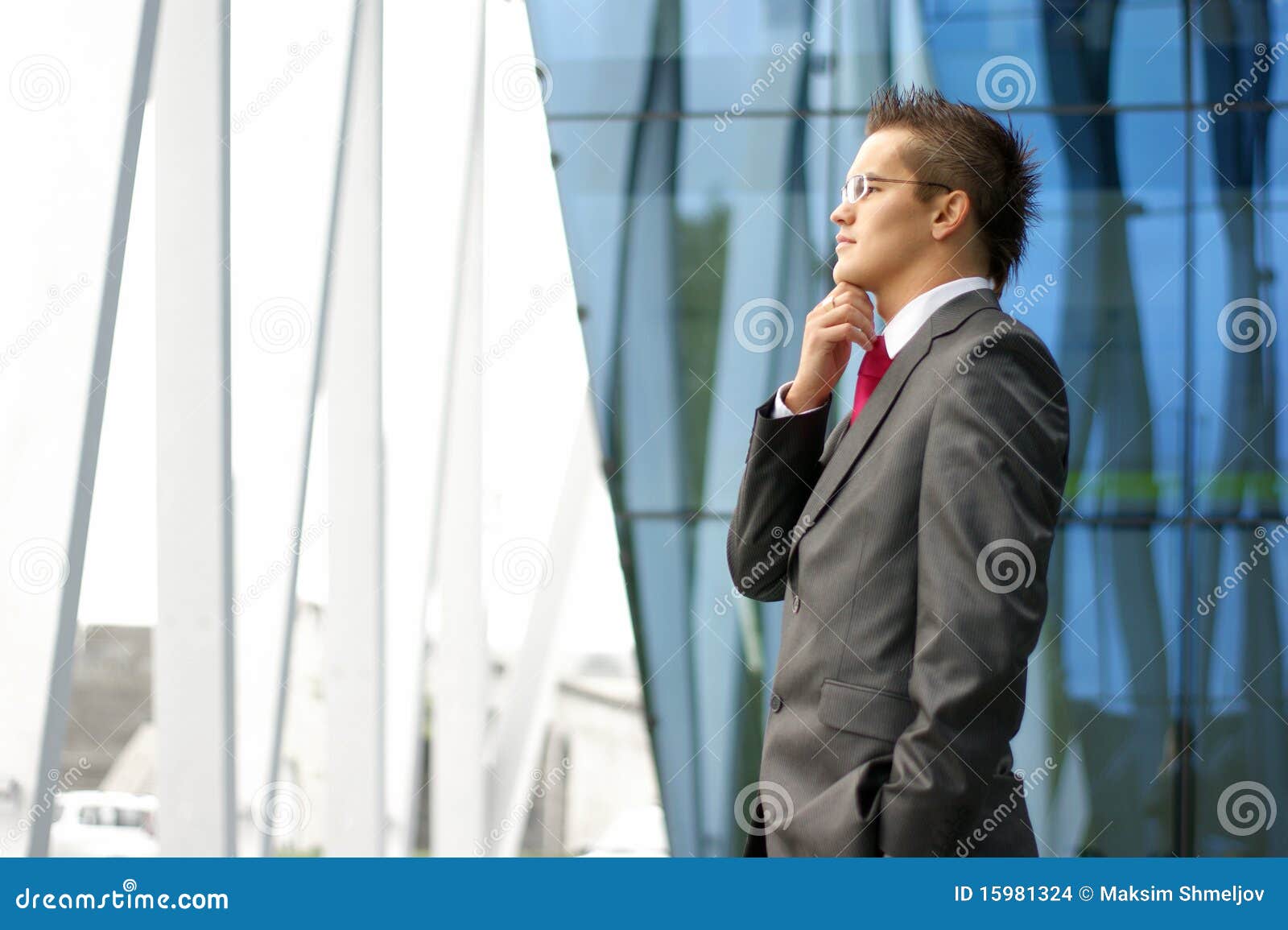 A Young Businessman is Looking Outside the Window Stock Photo - Image ...