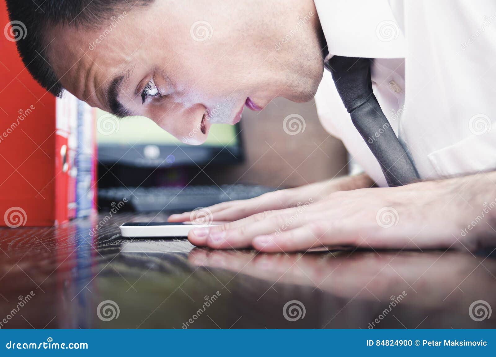 Young Businessman Looking at Phone in Shock Stock Photo - Image of ...