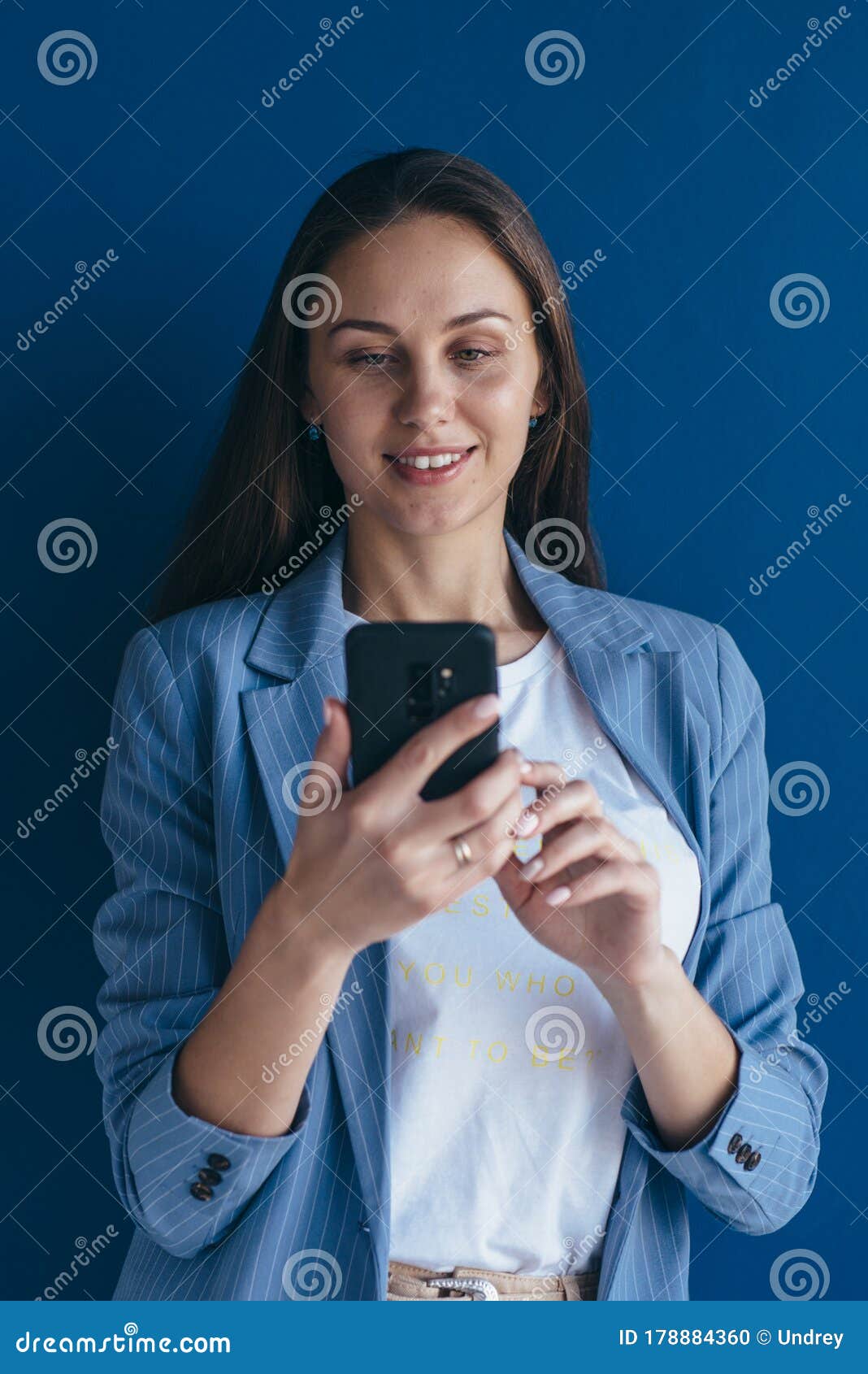 Young Businessman Looking at Smartphone, Using Mobile App. Stock Photo ...