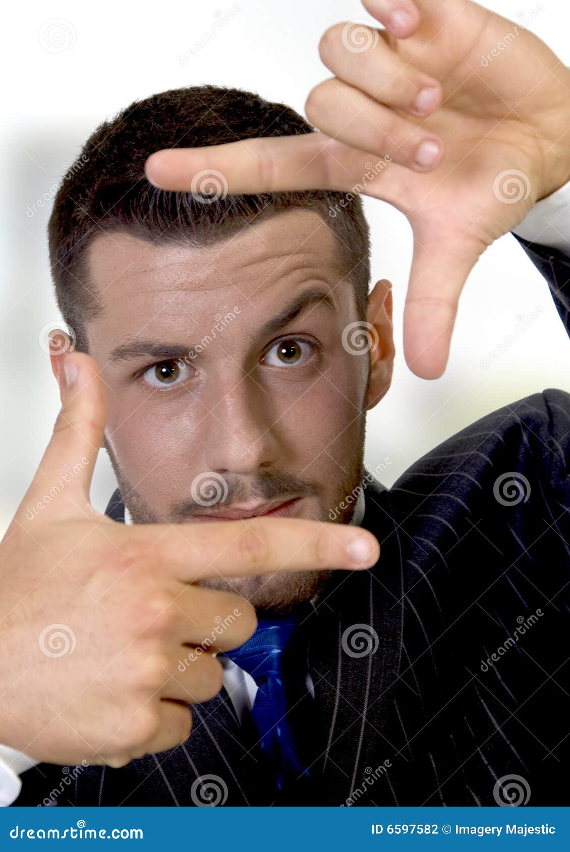 Young Businessman Making a Finger Frame Stock Photo - Image of latino ...