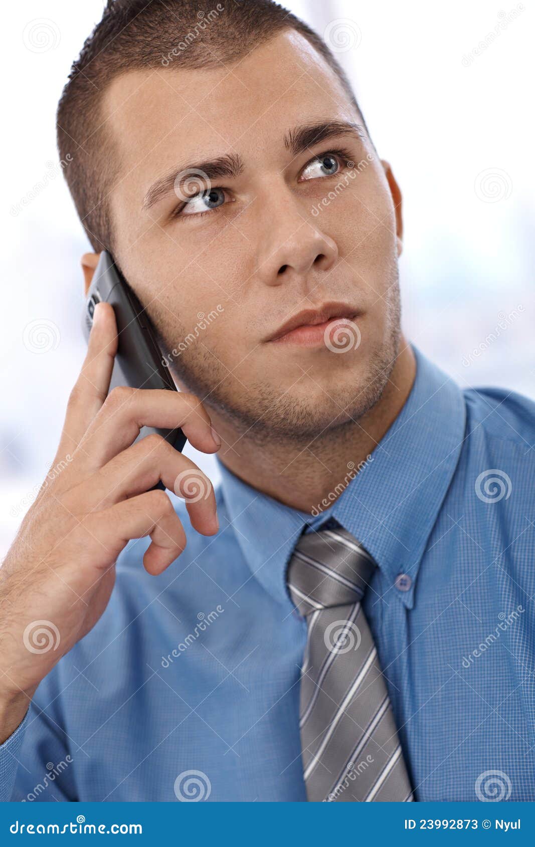 Young businessman on phone stock image. Image of color - 23992873