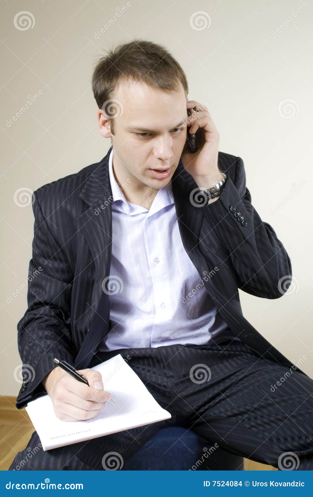 Young Businessman on the Phone Taking Notes Stock Photo - Image of ...