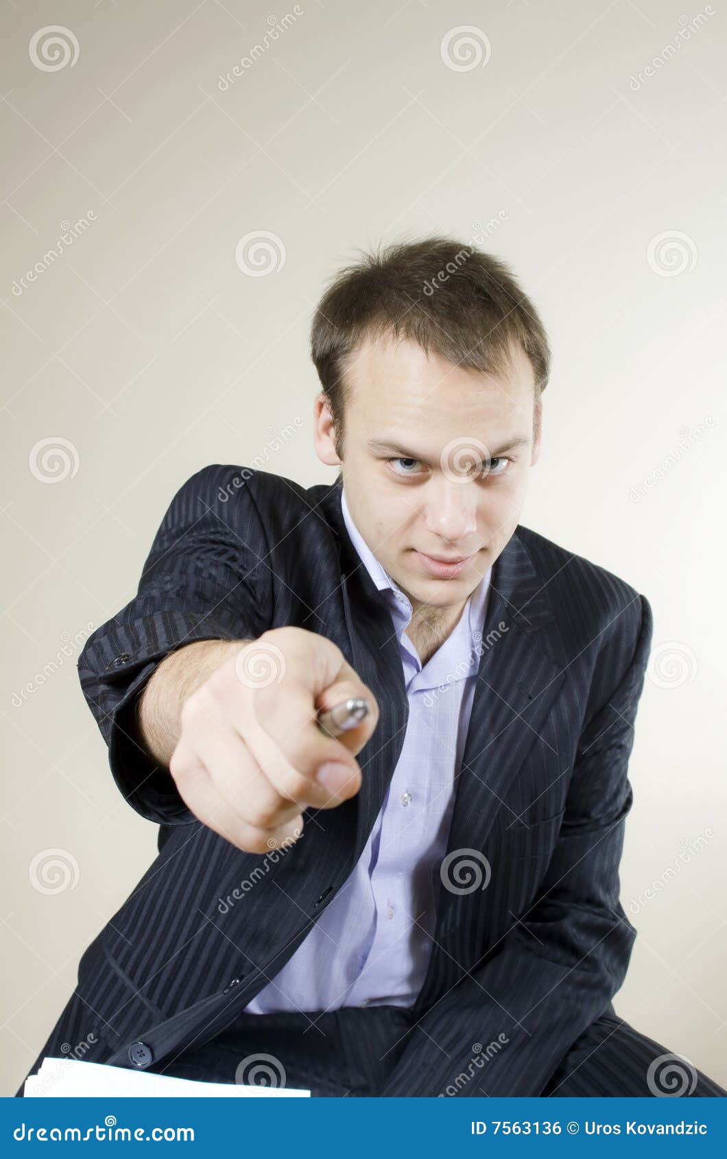 Young Businessman Pointing His Pen Stock Photo - Image of expression ...