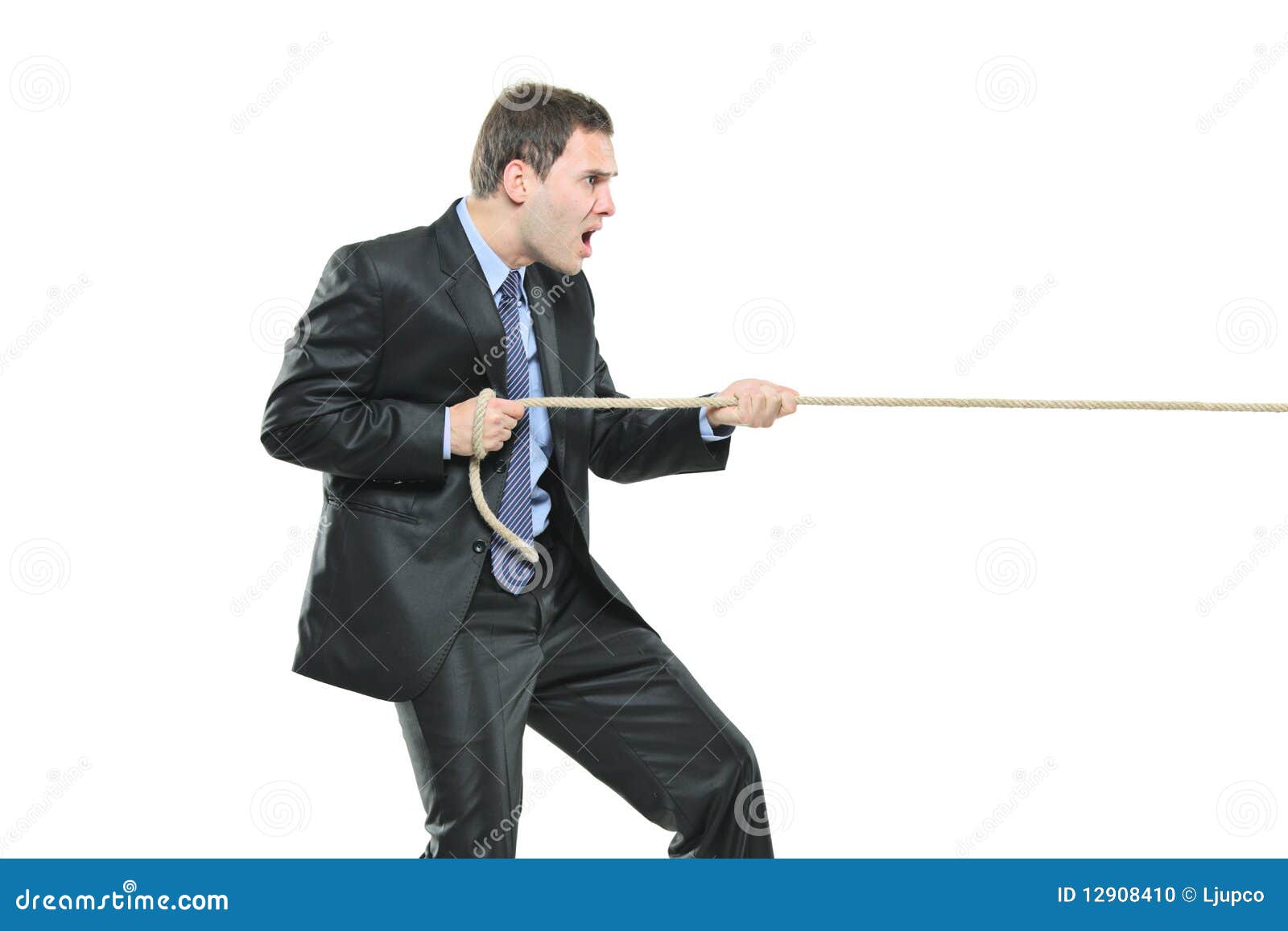 A Young Businessman Pulling a Rope Stock Photo - Image of determination ...