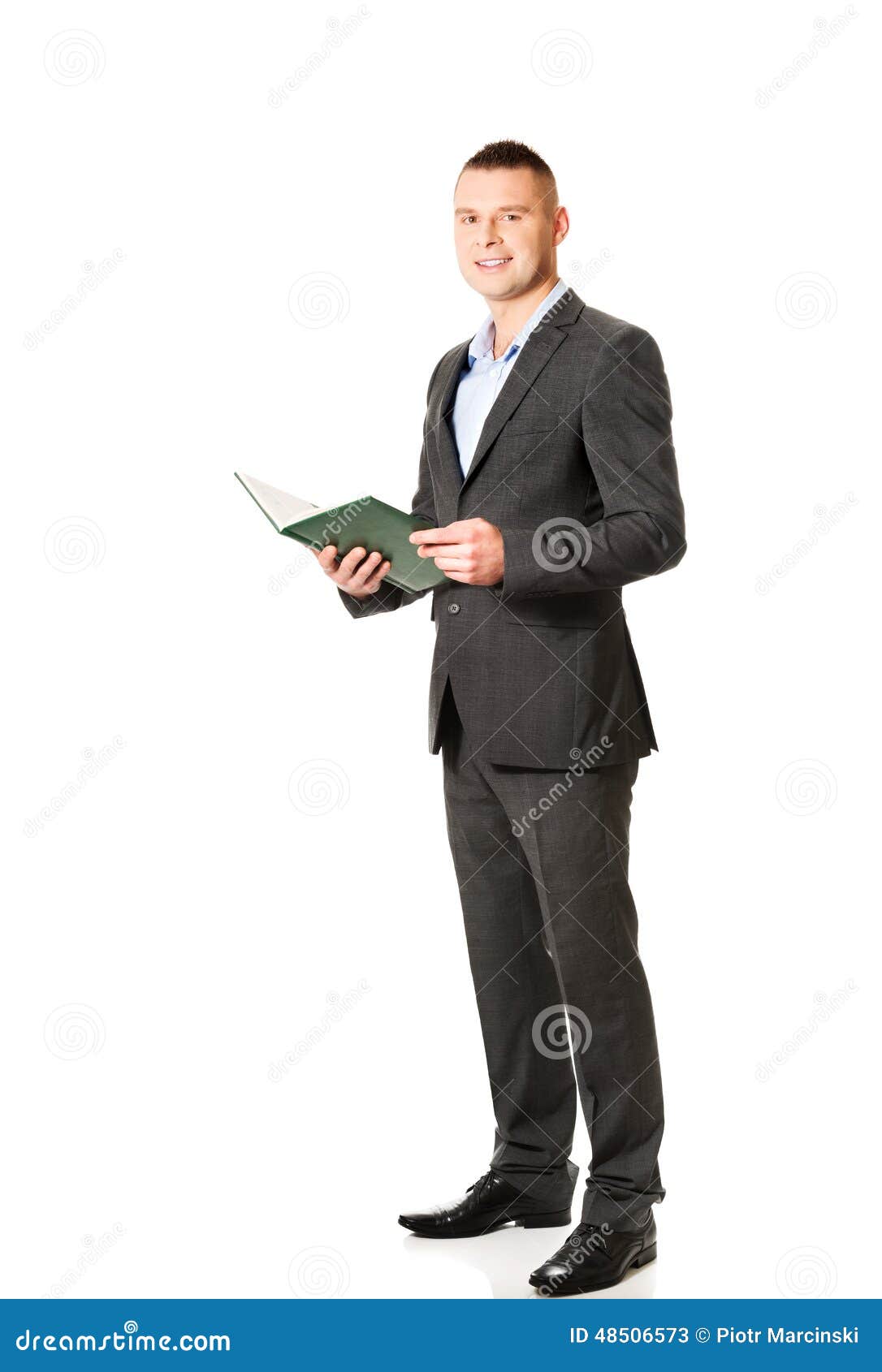 Young Businessman Reading His Note Book Stock Image - Image of male ...