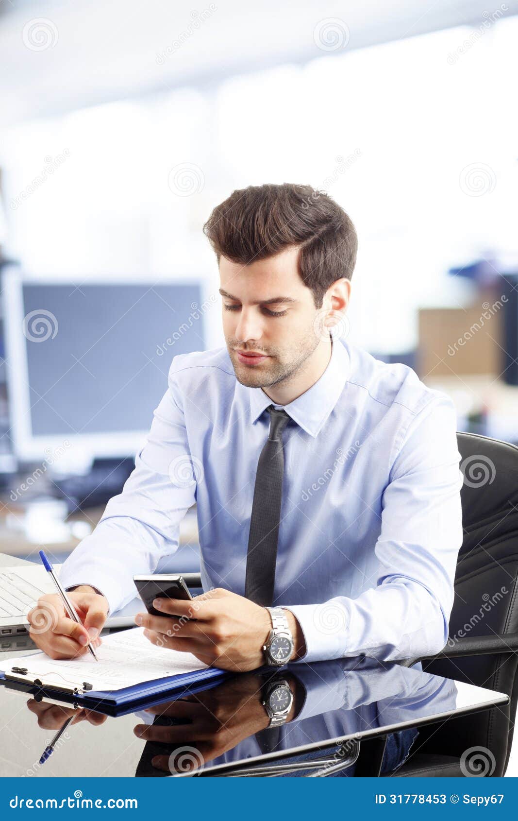 Young Businessman Reading a Text Message Stock Image - Image of message ...