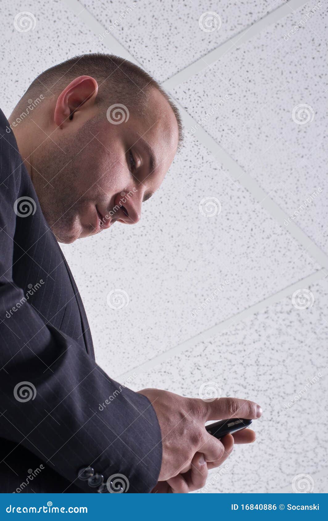 Young Businessman Receiving a Message Stock Photo - Image of looking ...