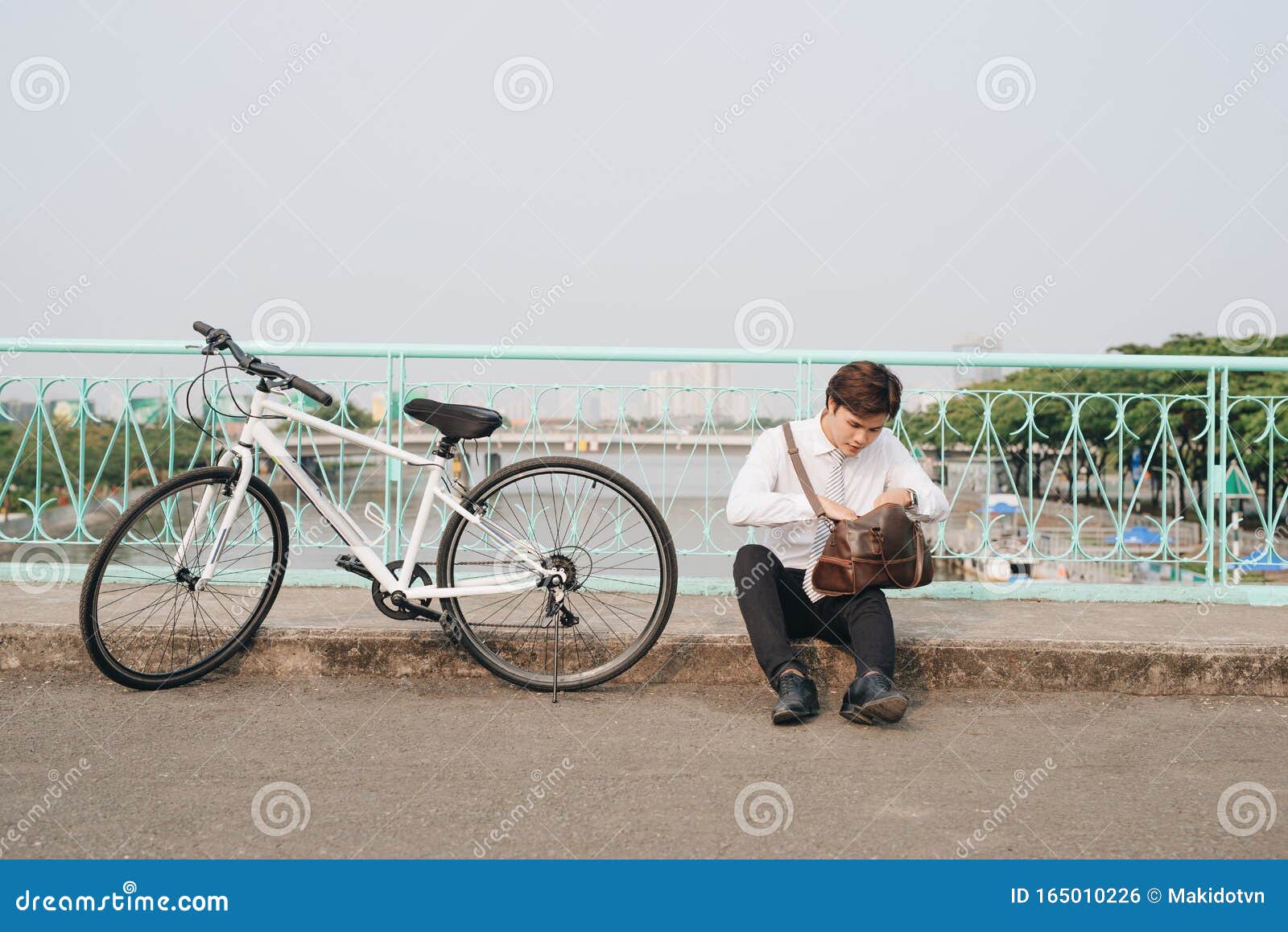 Young Businessman Searching Items in His Bag Stock Photo - Image of ...