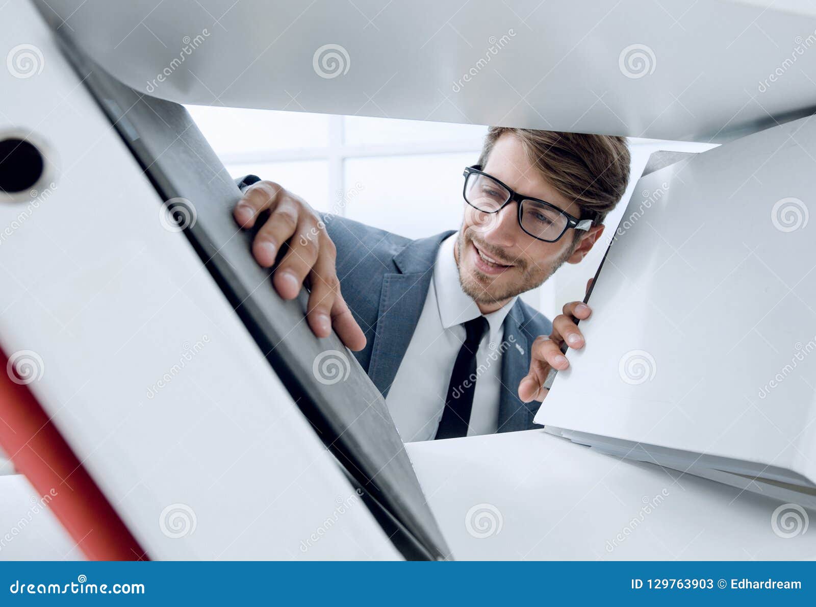 Young Businessman Selects a Folder for Documents Stock Image - Image of ...