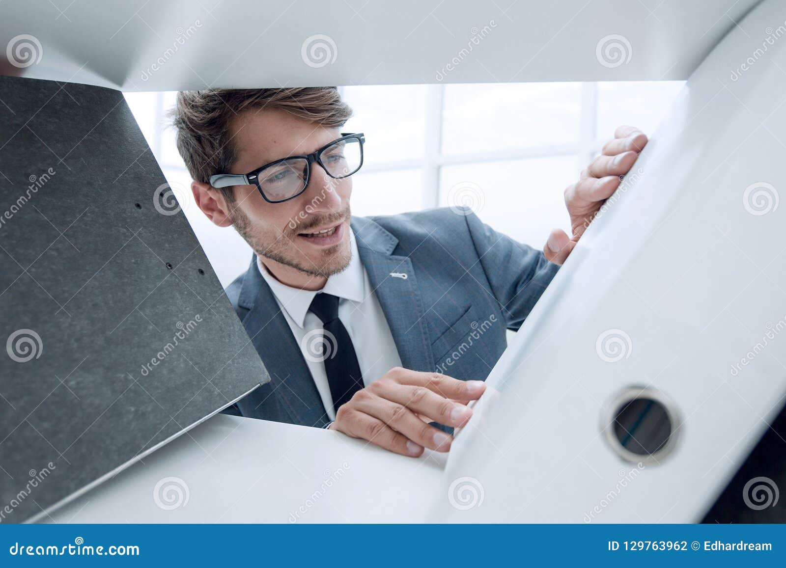 Young Businessman Selects a Folder for Documents Stock Photo - Image of ...