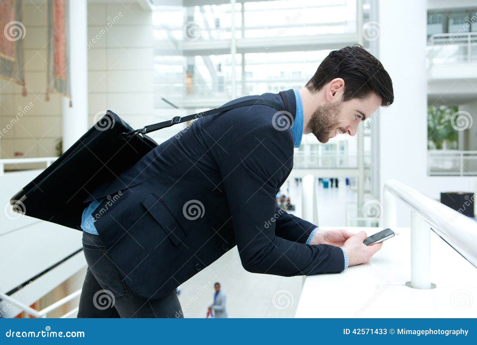 Young Businessman Sending Text Message Stock Image - Image of handsome ...