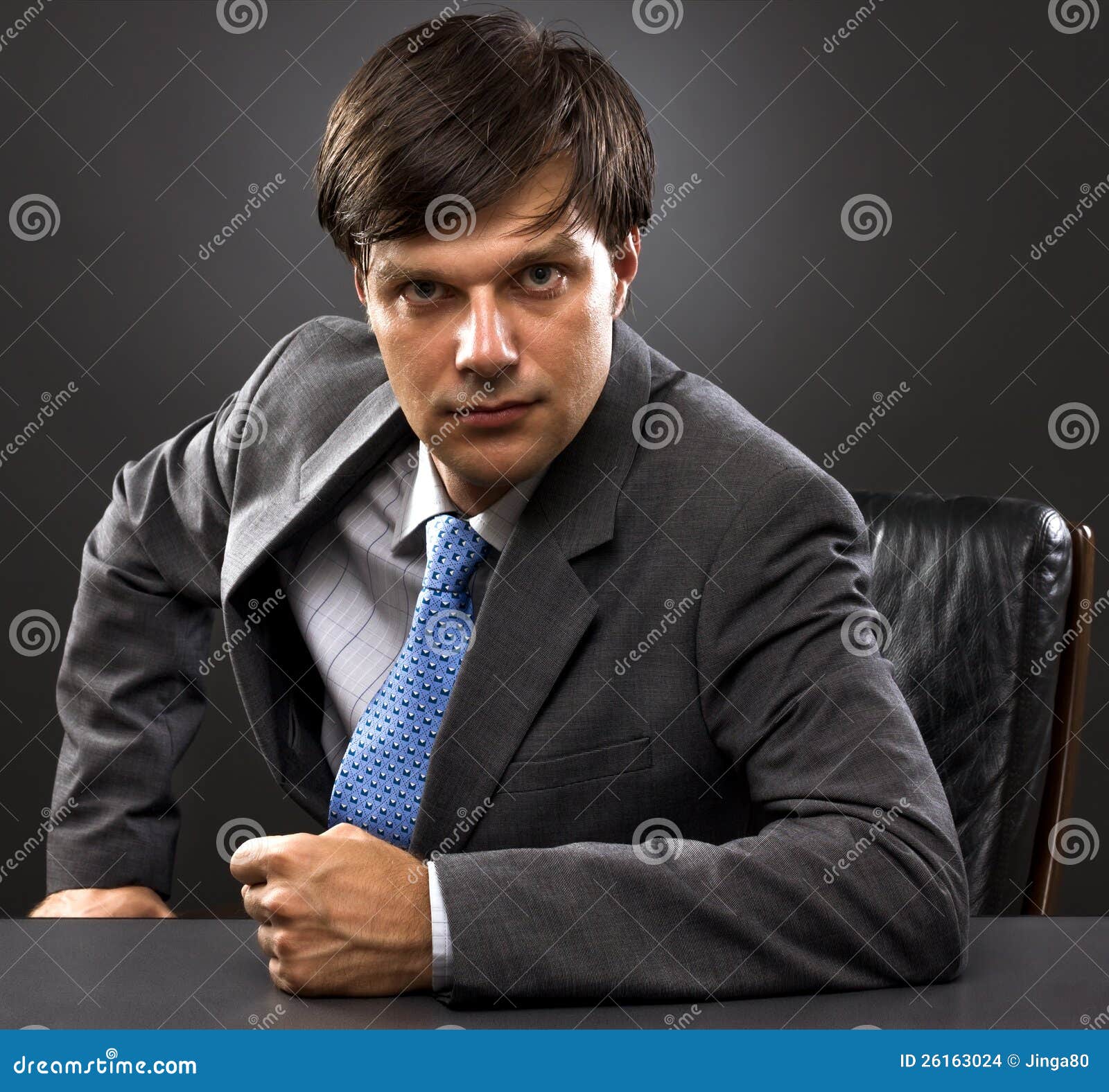 Young Businessman Sitting Behind the Desk Stock Photo - Image of ...