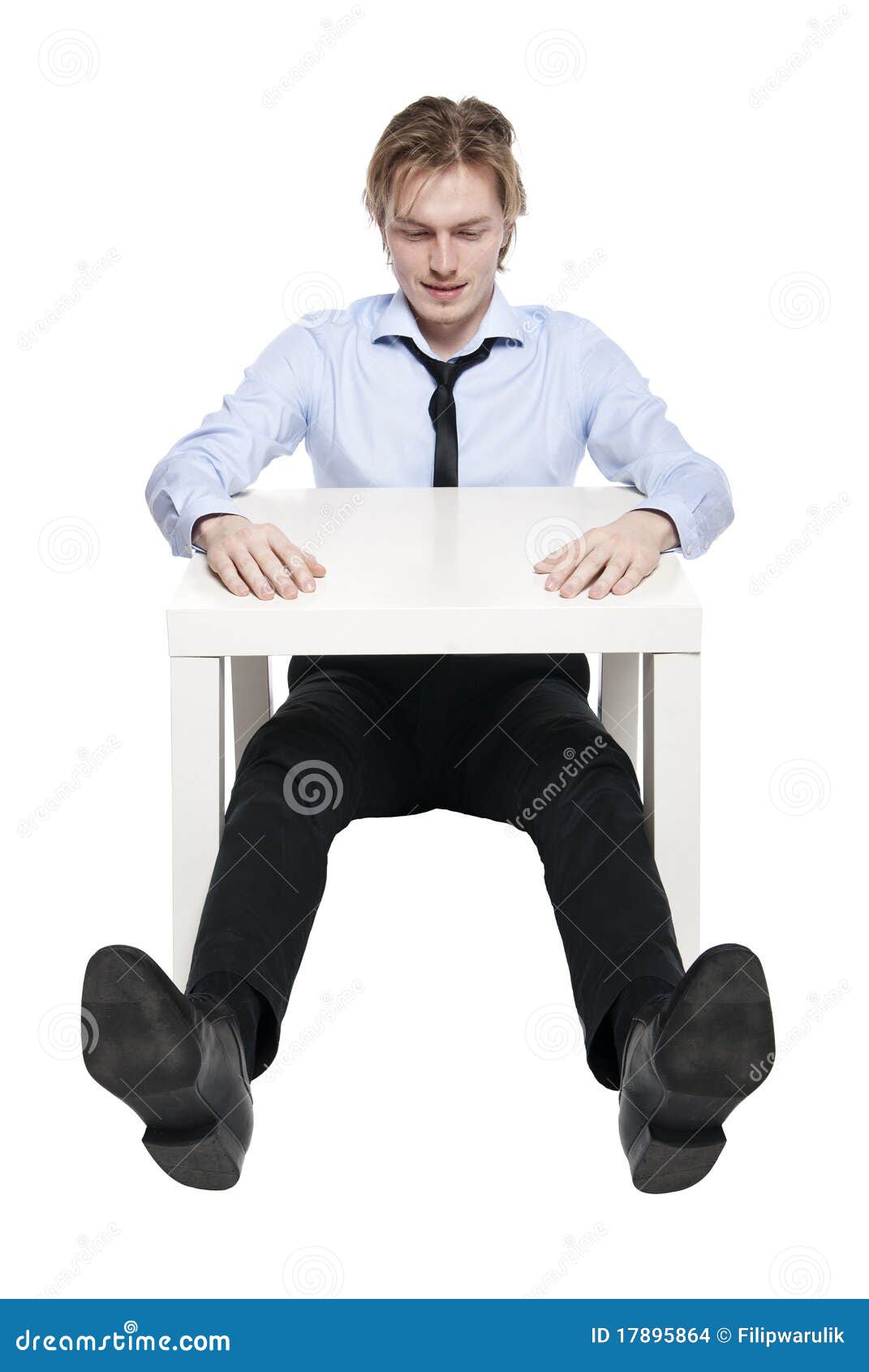 Young Businessman Sitting At Funny Desk Stock Images - Image: 17895864