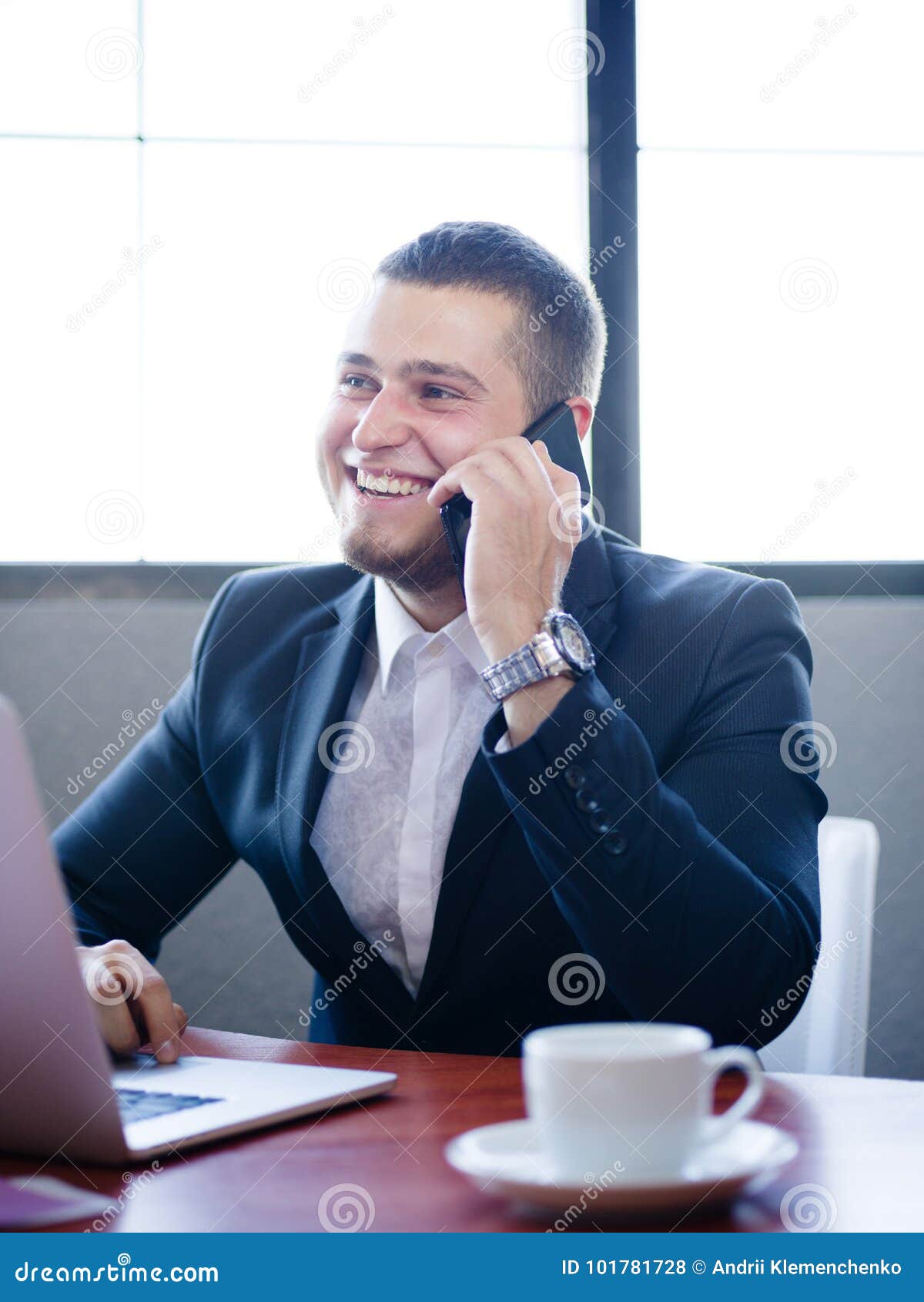 Young Businessman Sitting at His Desk with Laptop Stock Photo - Image ... Young Businessman Sitting at His Desk with Laptop Stock Photo - Image ...