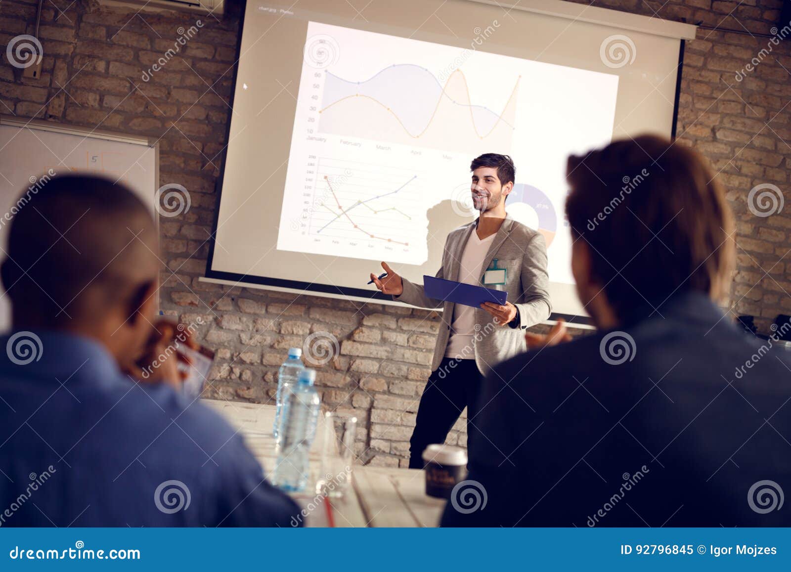 Businessman Speak on Seminar Using Data and Chards on Board Stock Image ...