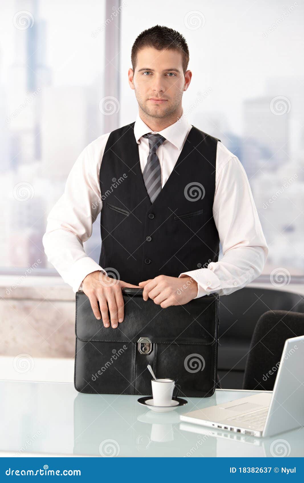 Young Businessman Standing at Desk in Office Stock Image - Image of ...