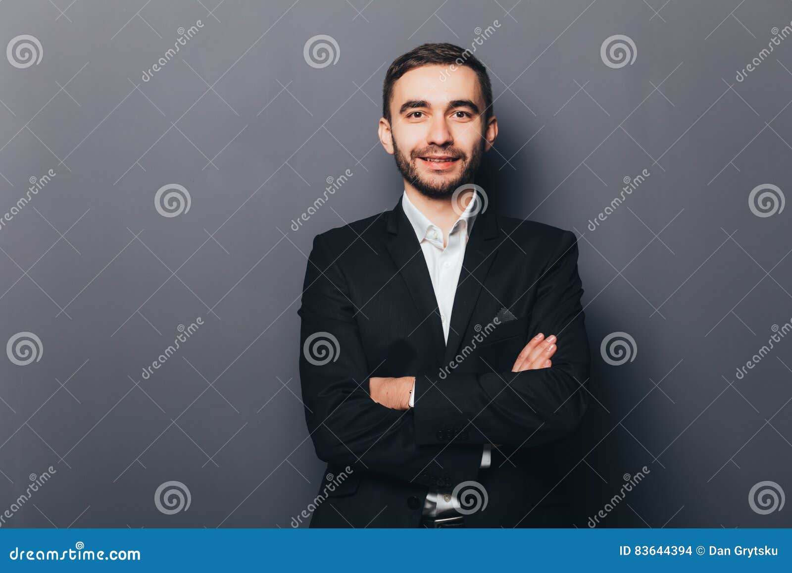 Young Businessman in Suit with Crossed Hands Stock Photo - Image of ...