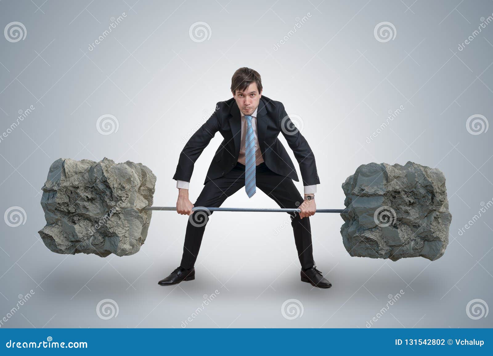 Young Businessman in Suit is Lifting Heavy Weights. Stock Photo - Image ...