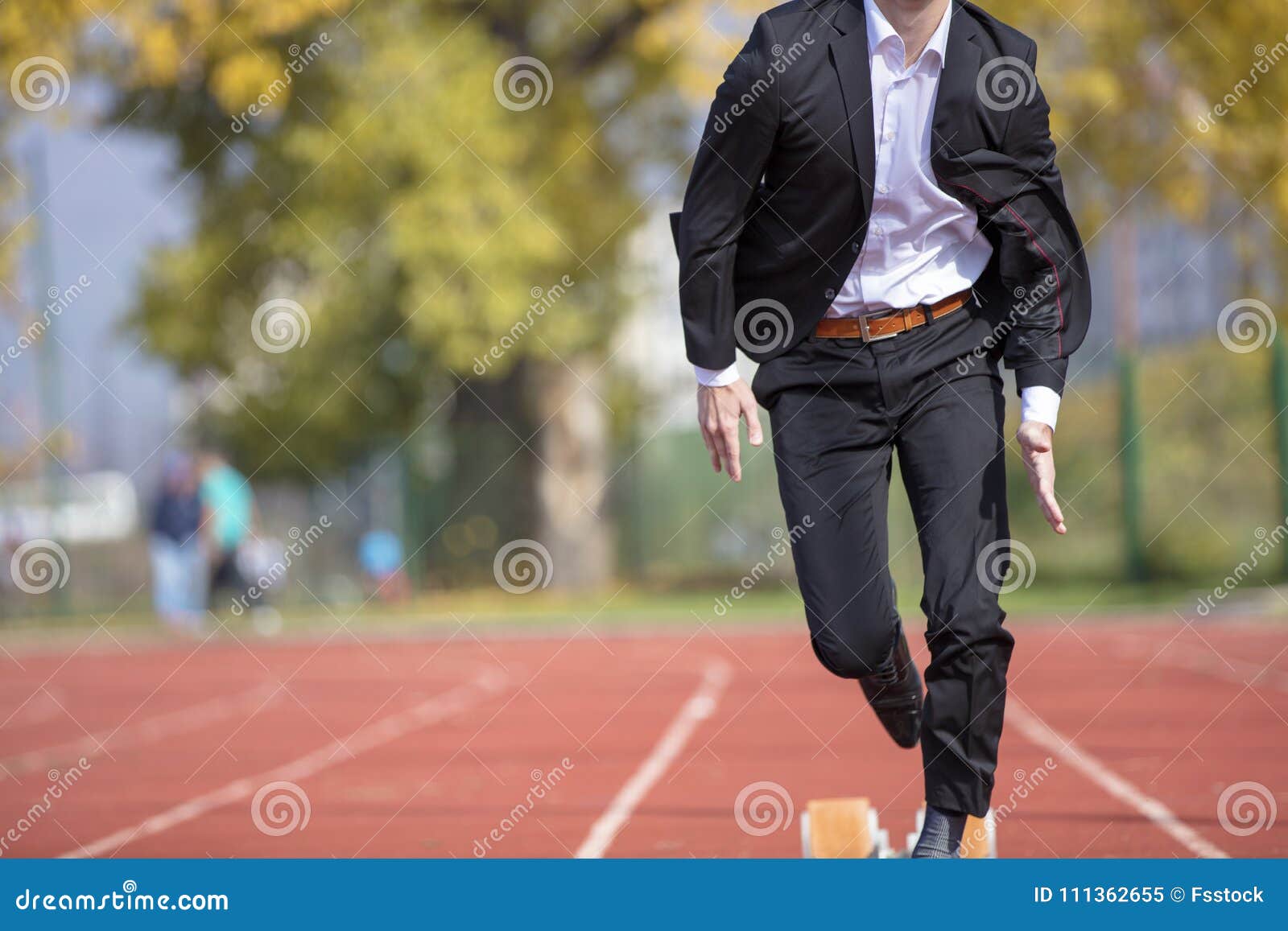 Young Businessman in Suit Running on Track Stock Image - Image of ...