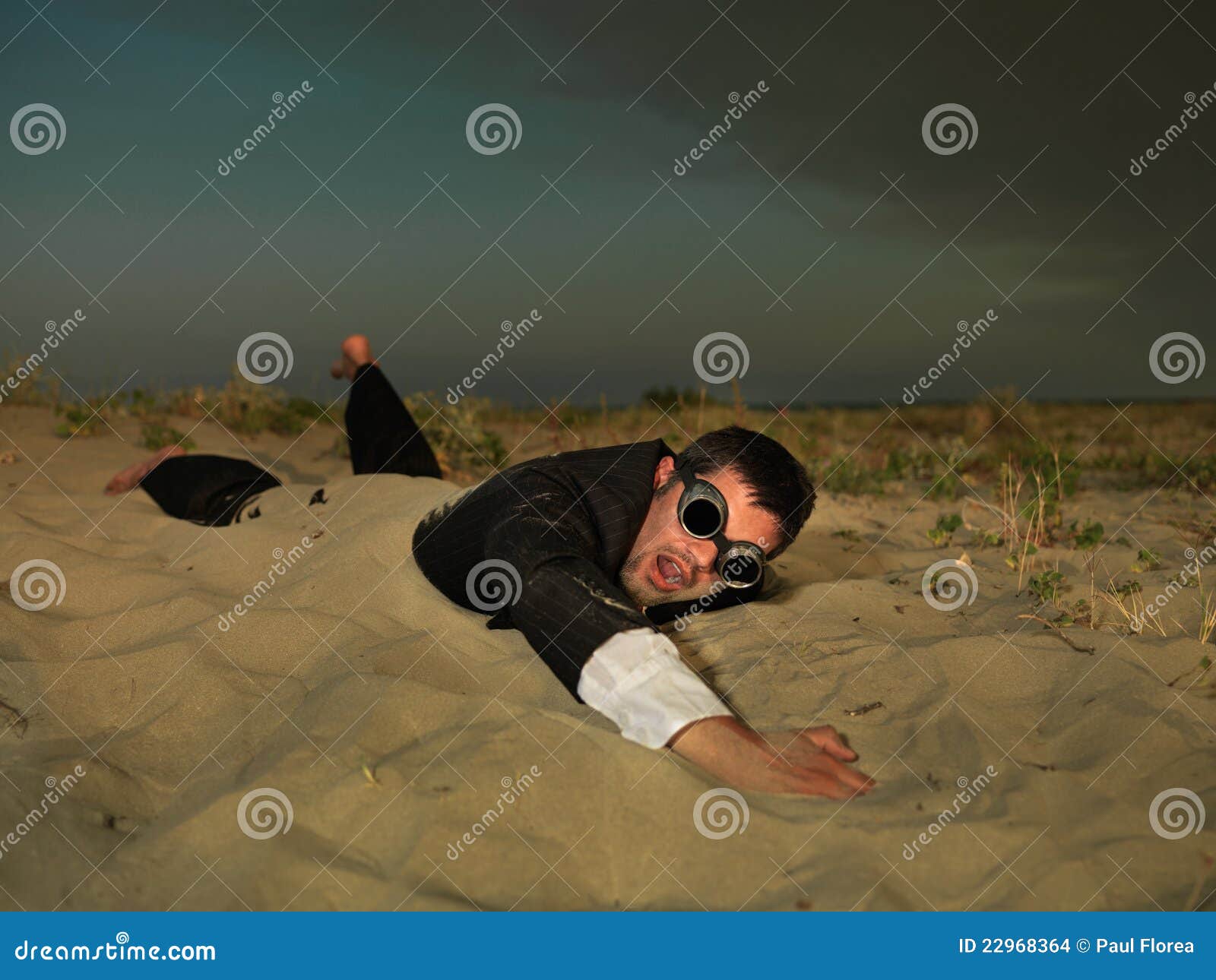 Young Businessman Swimming through Sand in Suit Stock Photo - Image of ...