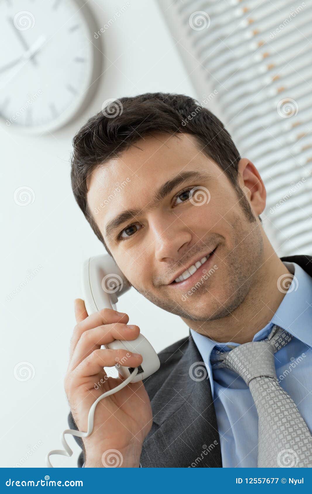Young Businessman Talking on Landline Phone Stock Image - Image of ...