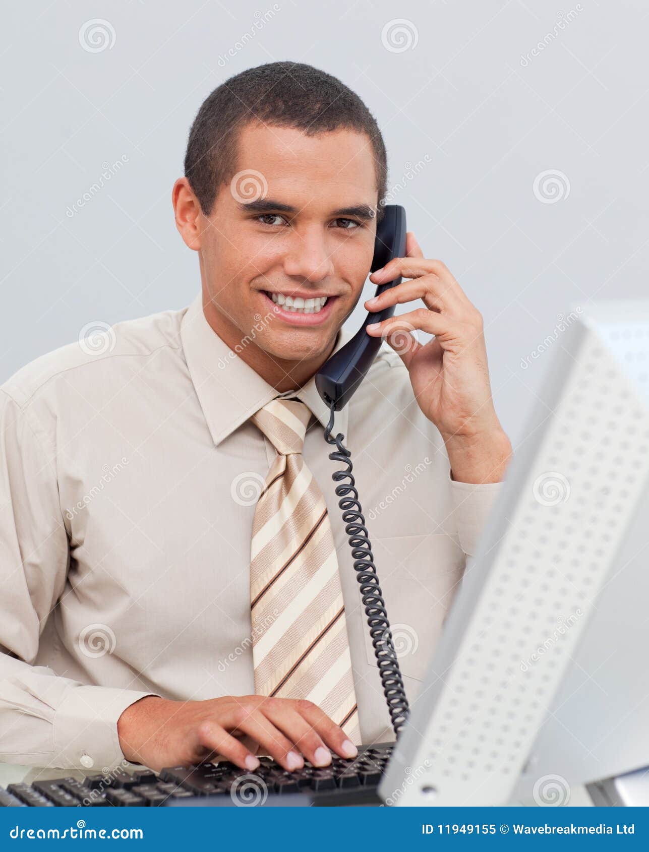 Young Businessman Talking on Phone in the Office Stock Image - Image of ...