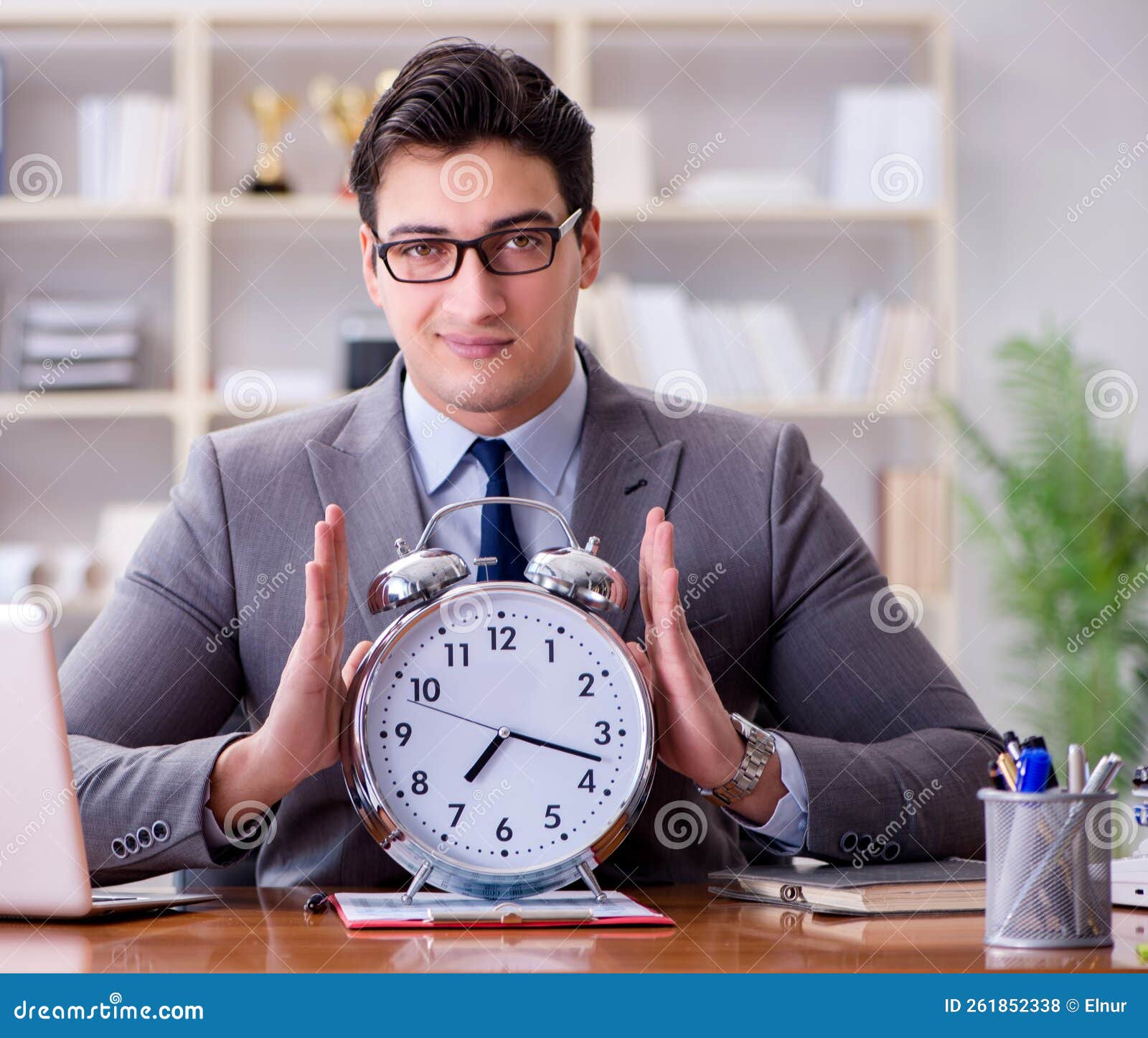 Young Businessman in Time Management Concept Stock Photo - Image of ...