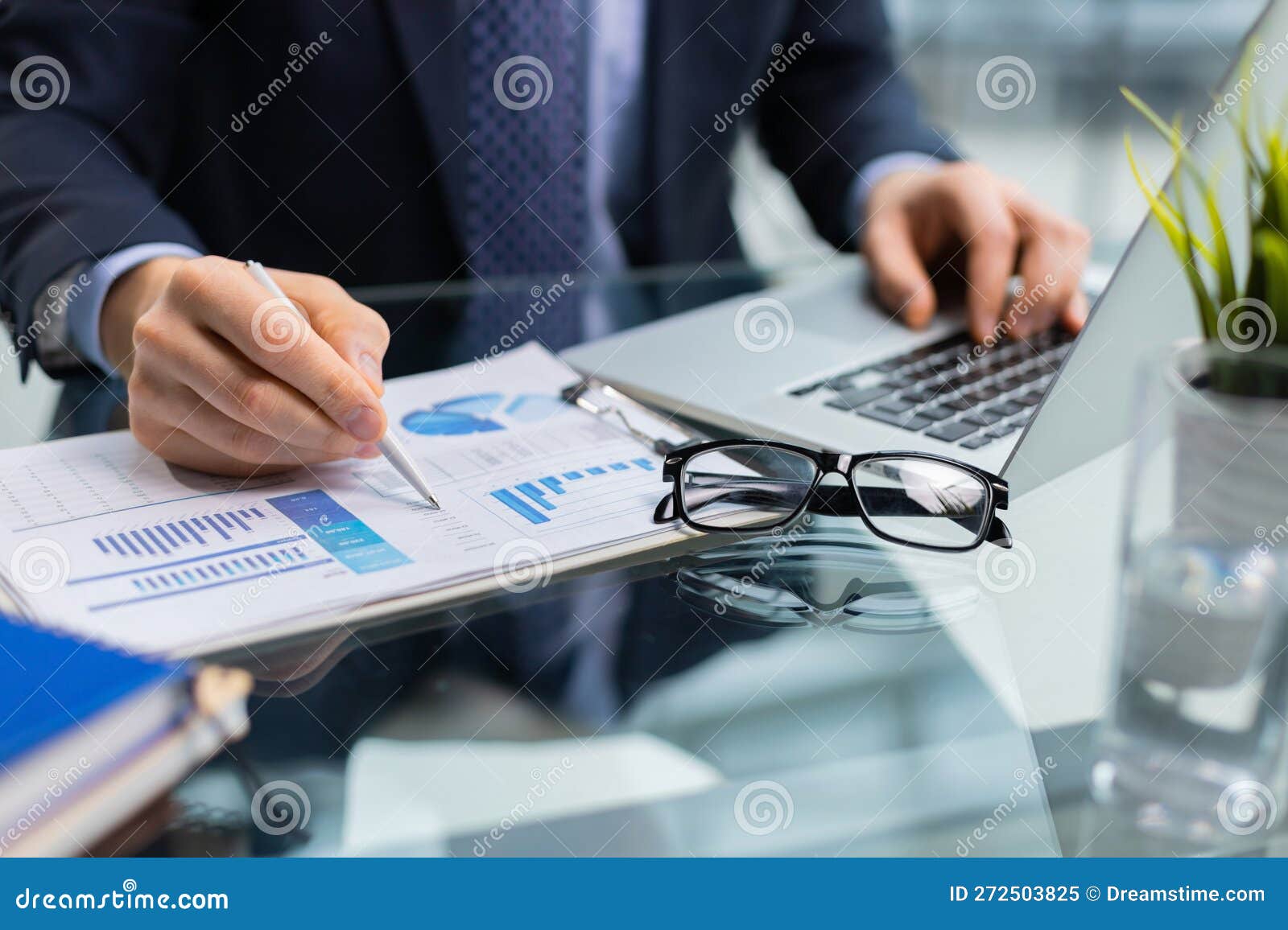 Young Businessman Typing Computer Laptop with Graph Chart for Work ...