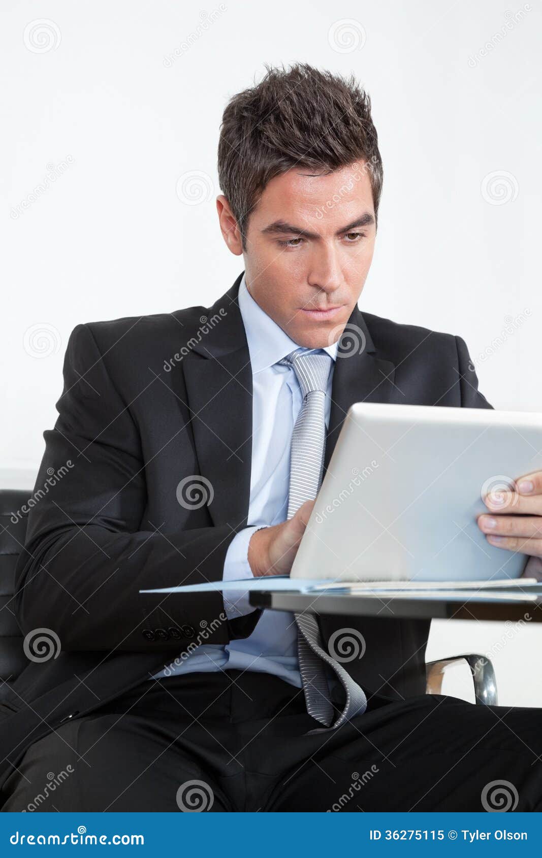 Young Businessman Using Digital Tablet in Office Stock Image - Image of ...