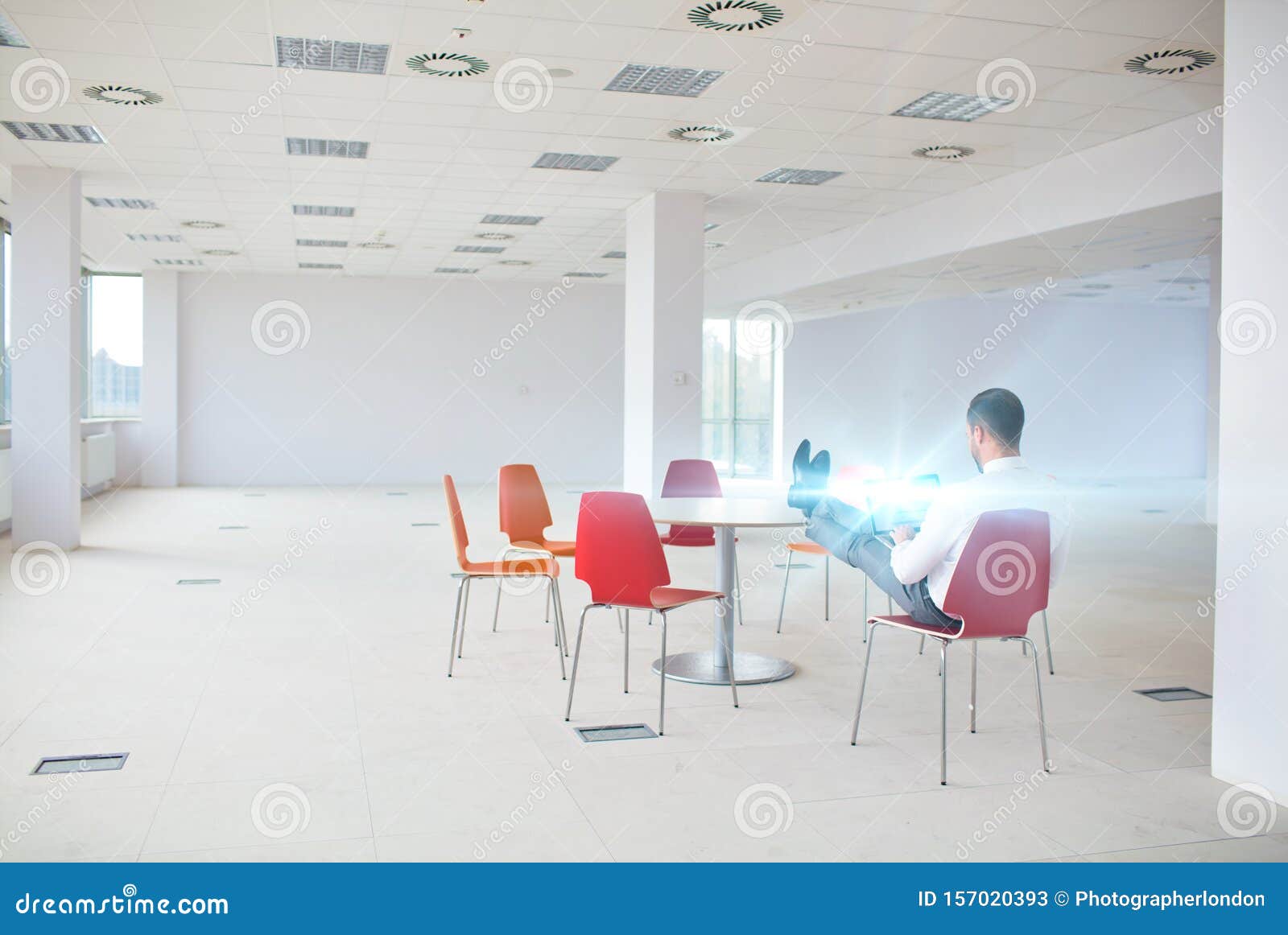 Rear View of Young Businessman Using Laptop at New Office Stock Image ... Rear View of Young Businessman Using Laptop at New Office Stock Image ...