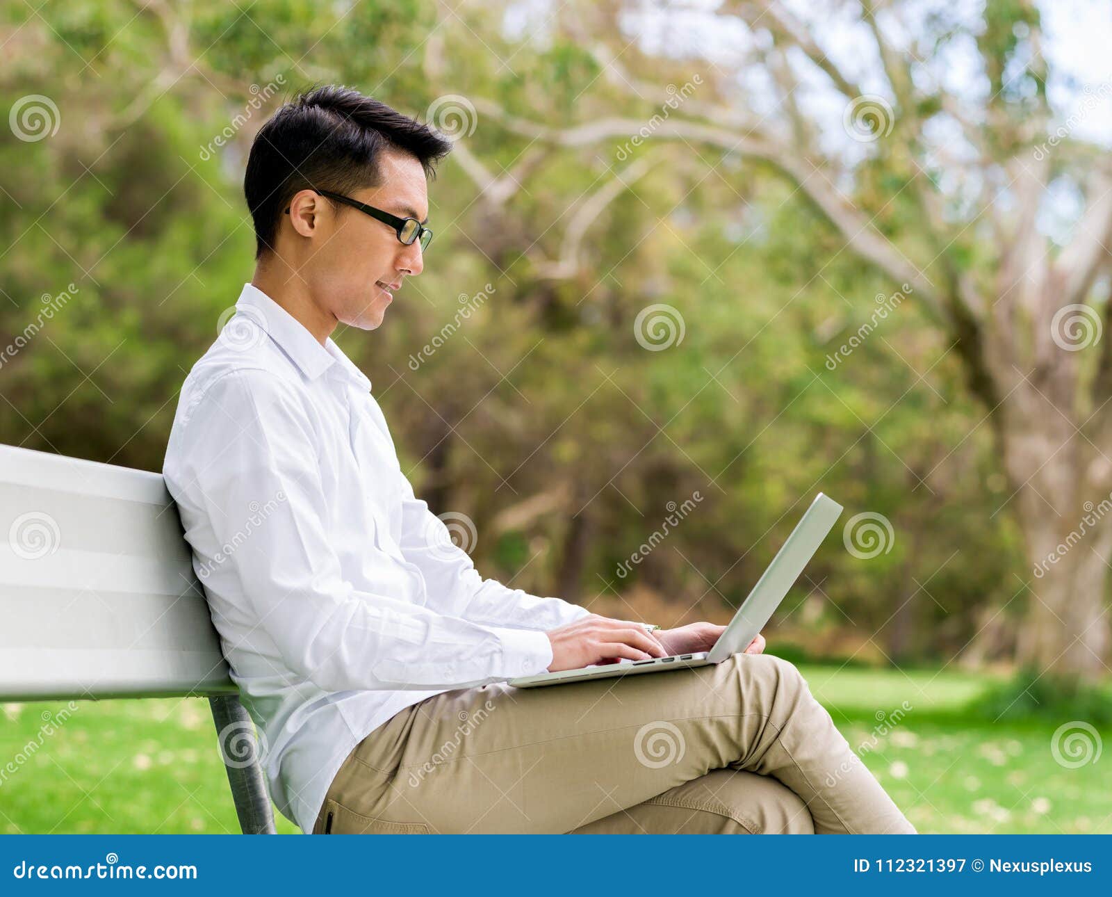 Young Businessman Using Laptop while Sitting Outdoors Stock Image ... Young Businessman Using Laptop while Sitting Outdoors Stock Image ...
