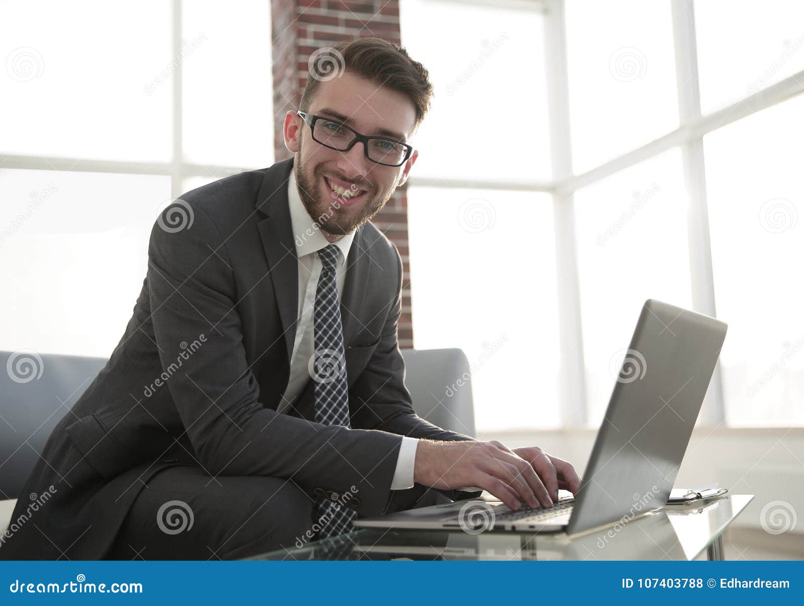 Young Businessman Using Laptop and Smiling Stock Photo - Image of ... Young Businessman Using Laptop and Smiling Stock Photo - Image of ...