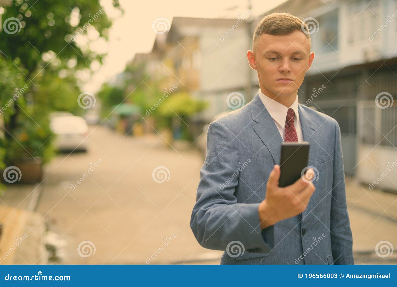 Young Businessman Using Mobile Phone in the Streets Outdoors Stock ...