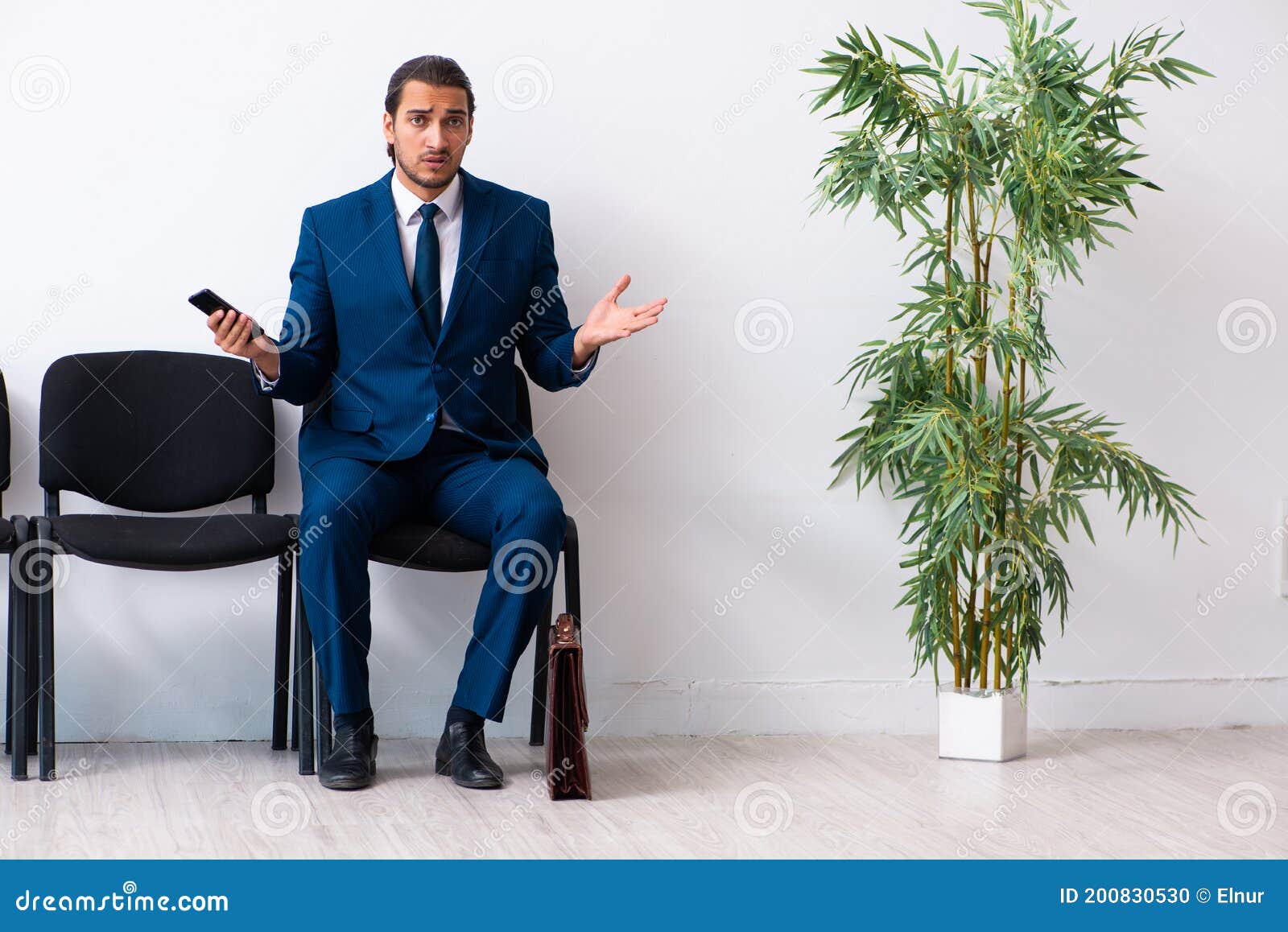 Young Businessman Waiting for an Interview at Hall Stock Photo - Image ...