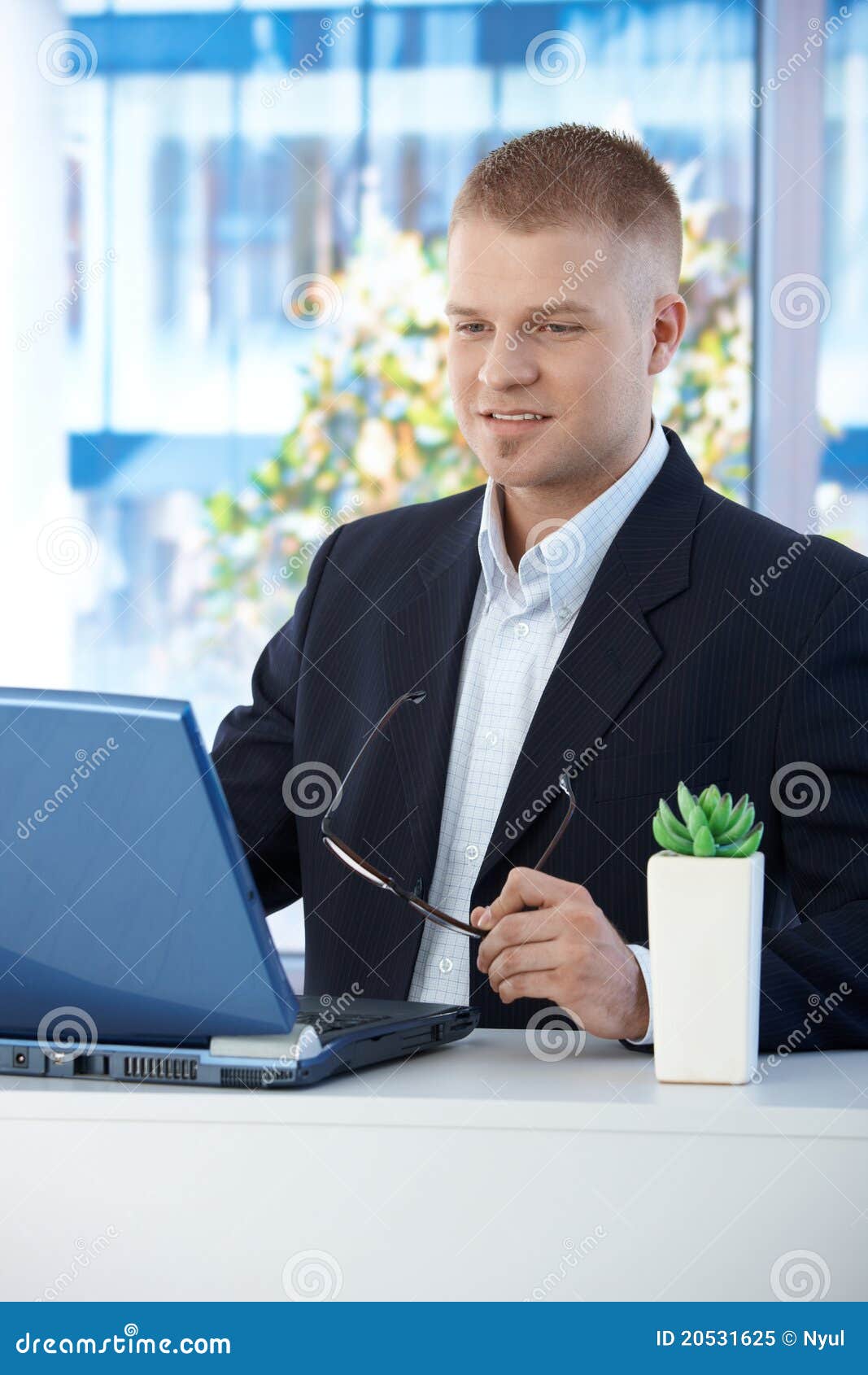 Young businessman at work stock image. Image of computer - 20531625