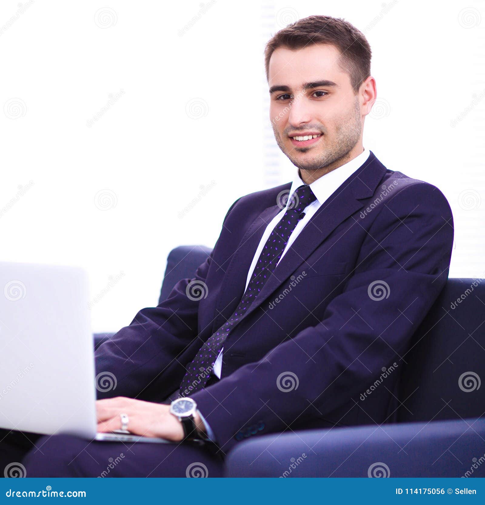 Young Businessman Working in Office, Sitting at Desk Stock Photo ... Young Businessman Working in Office, Sitting at Desk Stock Photo ...