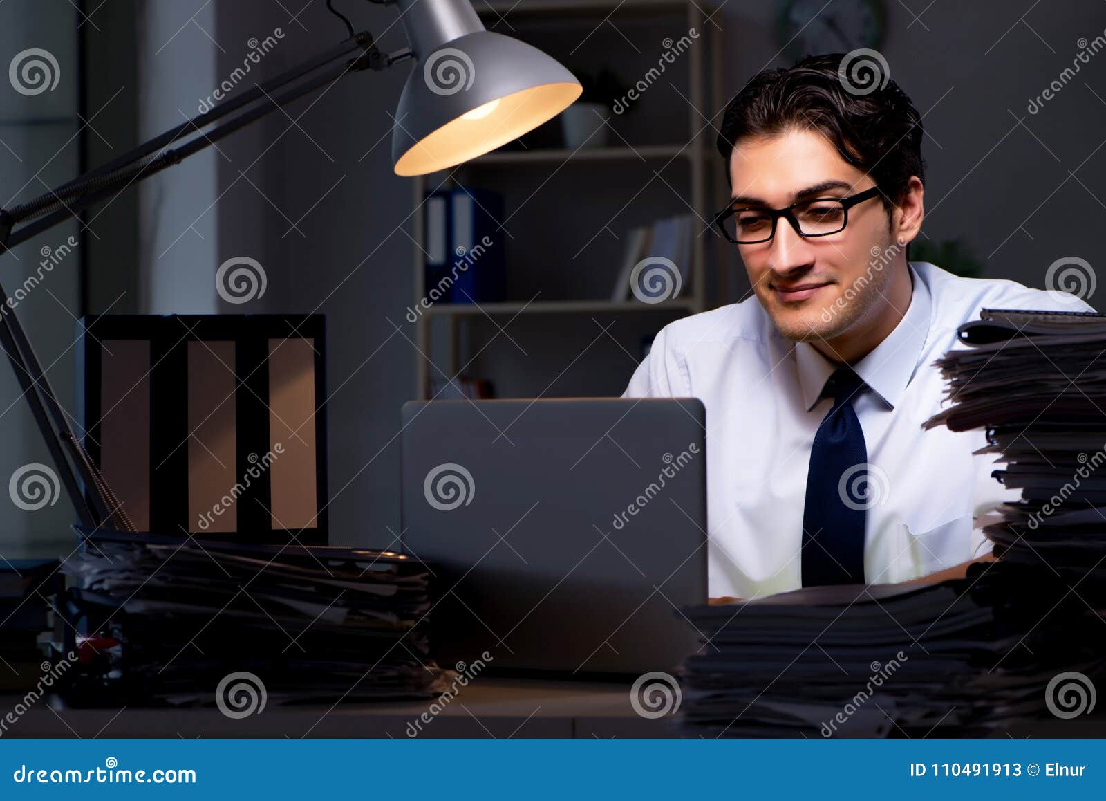The Young Businessman Working Overtime Late in Office Stock Image ...