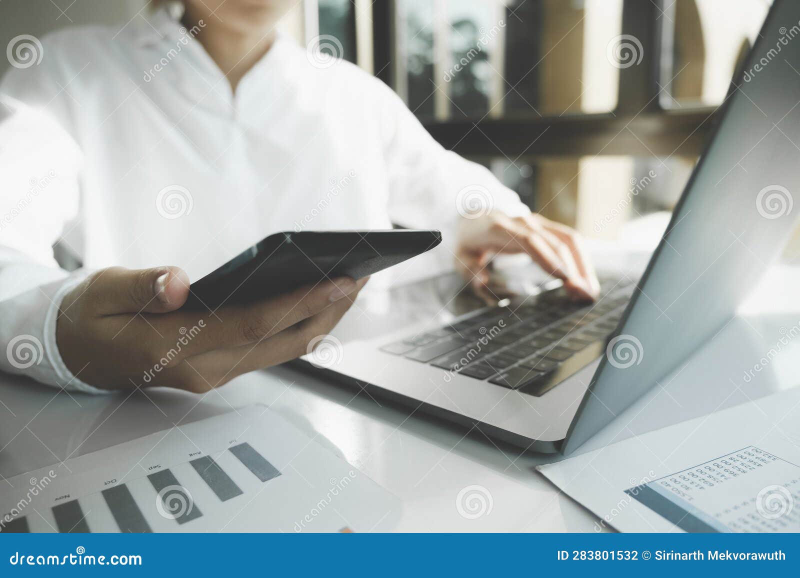 Young Businessman Working Using Texting Cell Phone Typing Computer ...